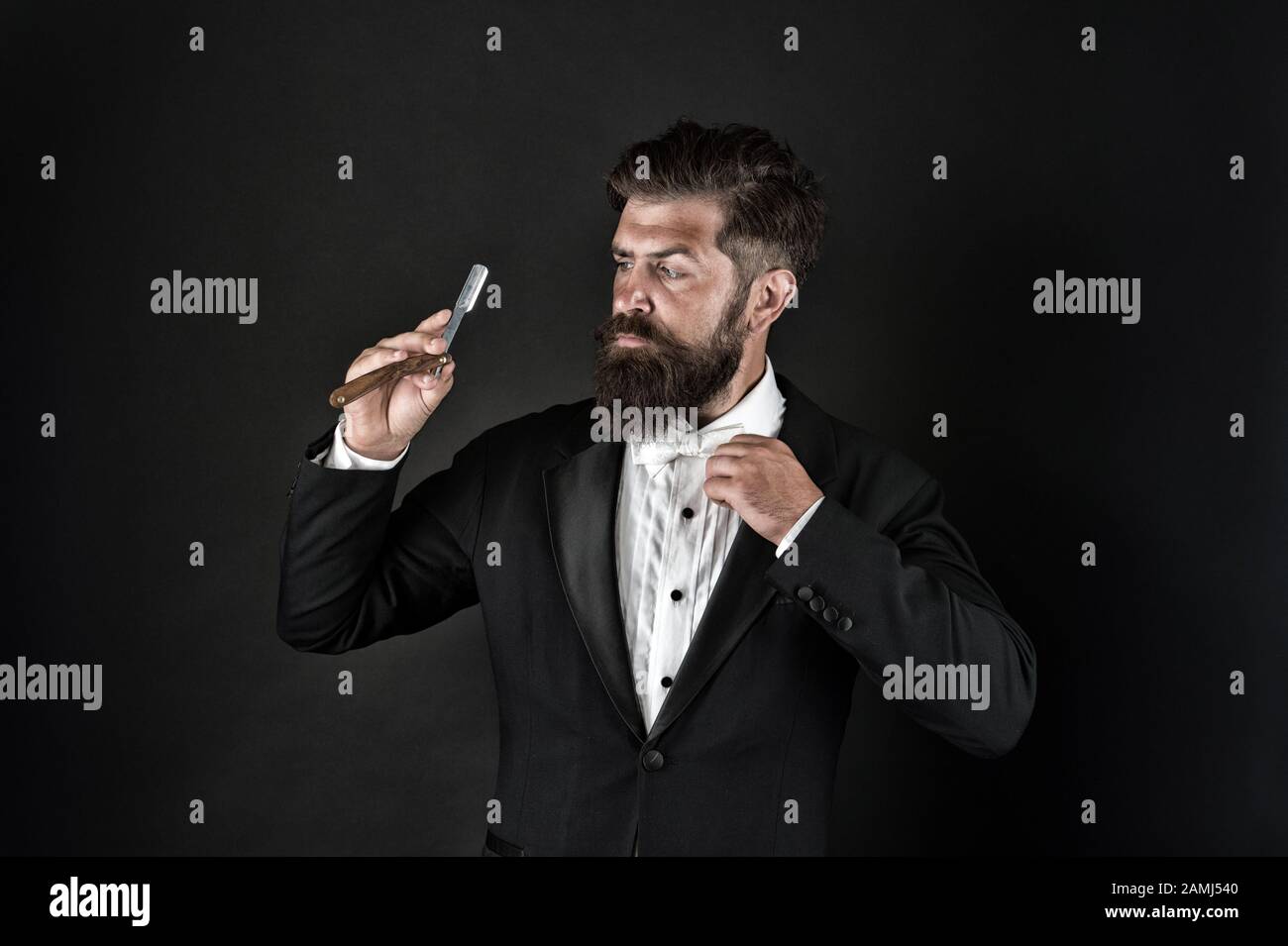 Retro appeal. Bearded man hold retro razor. Professional barber dark ...