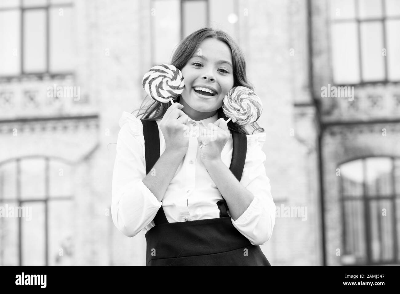 Crazy about sweets. Happy kid with candy. School nutrition. Calories ...