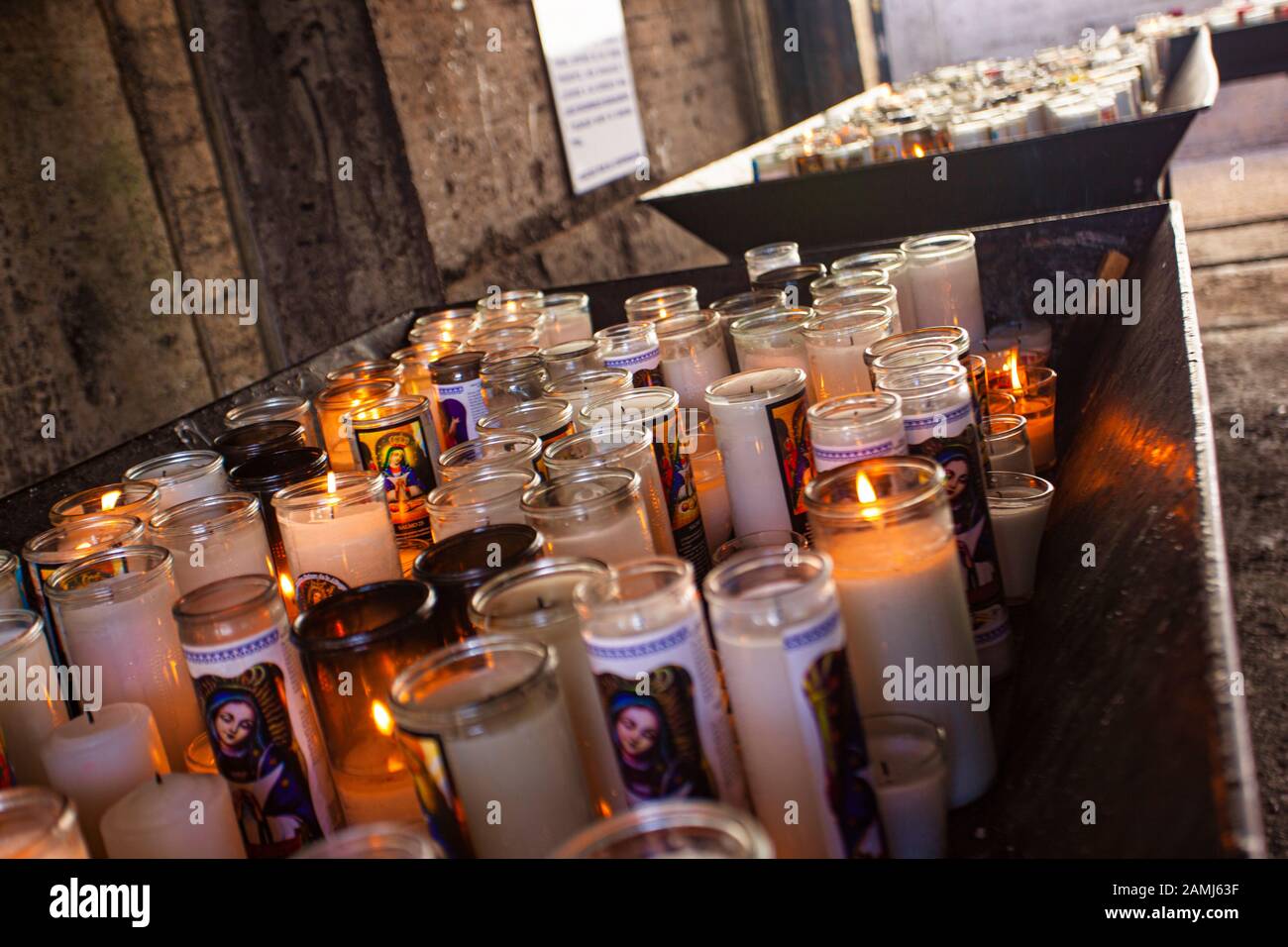 Many religious candles 2 Stock Photo - Alamy