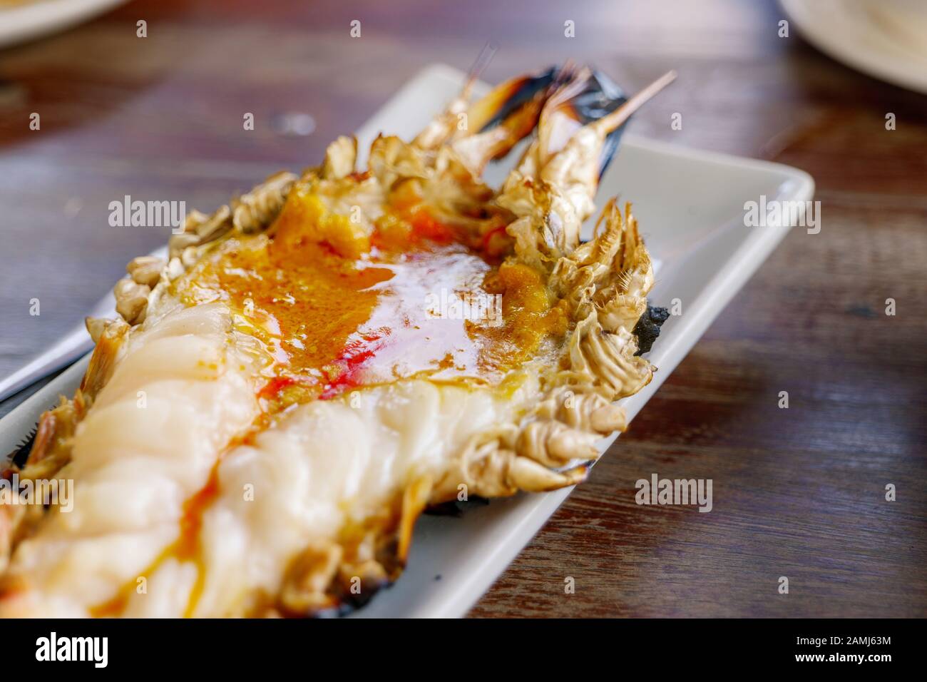 Close up view at one Grilled Giant River Prawn with full of roe and fat ...