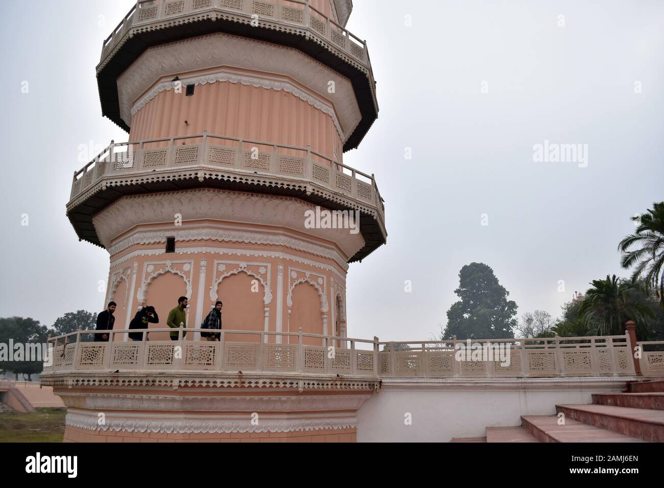 Visitors walk around the Sheesh Mahal (Palace of Mirrors) in Patiala ...