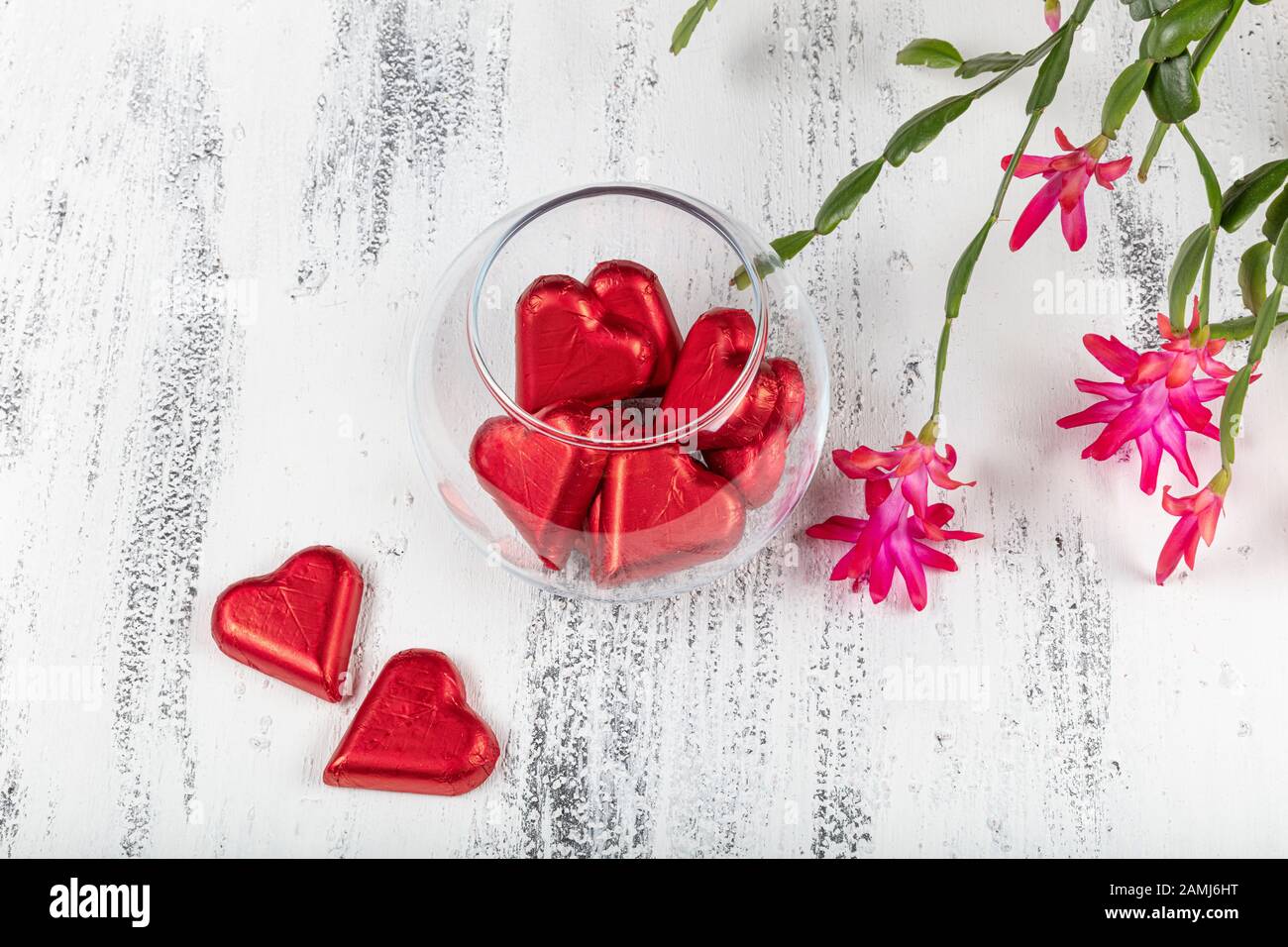 Heart shape chocolate candies wrapped in colorful foil for Valentine's ...