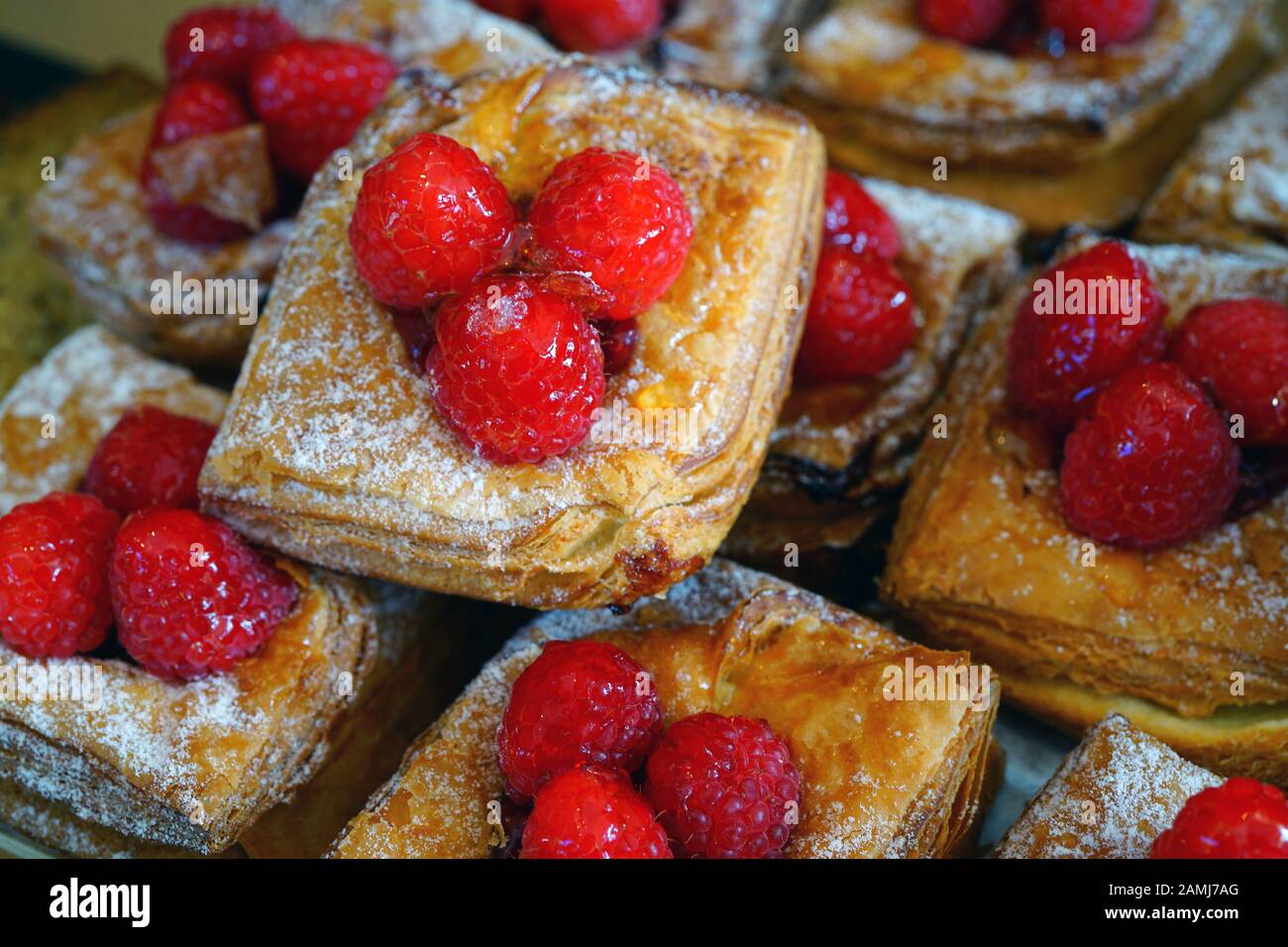 Danish pastry with raspberries on top Stock Photo - Alamy