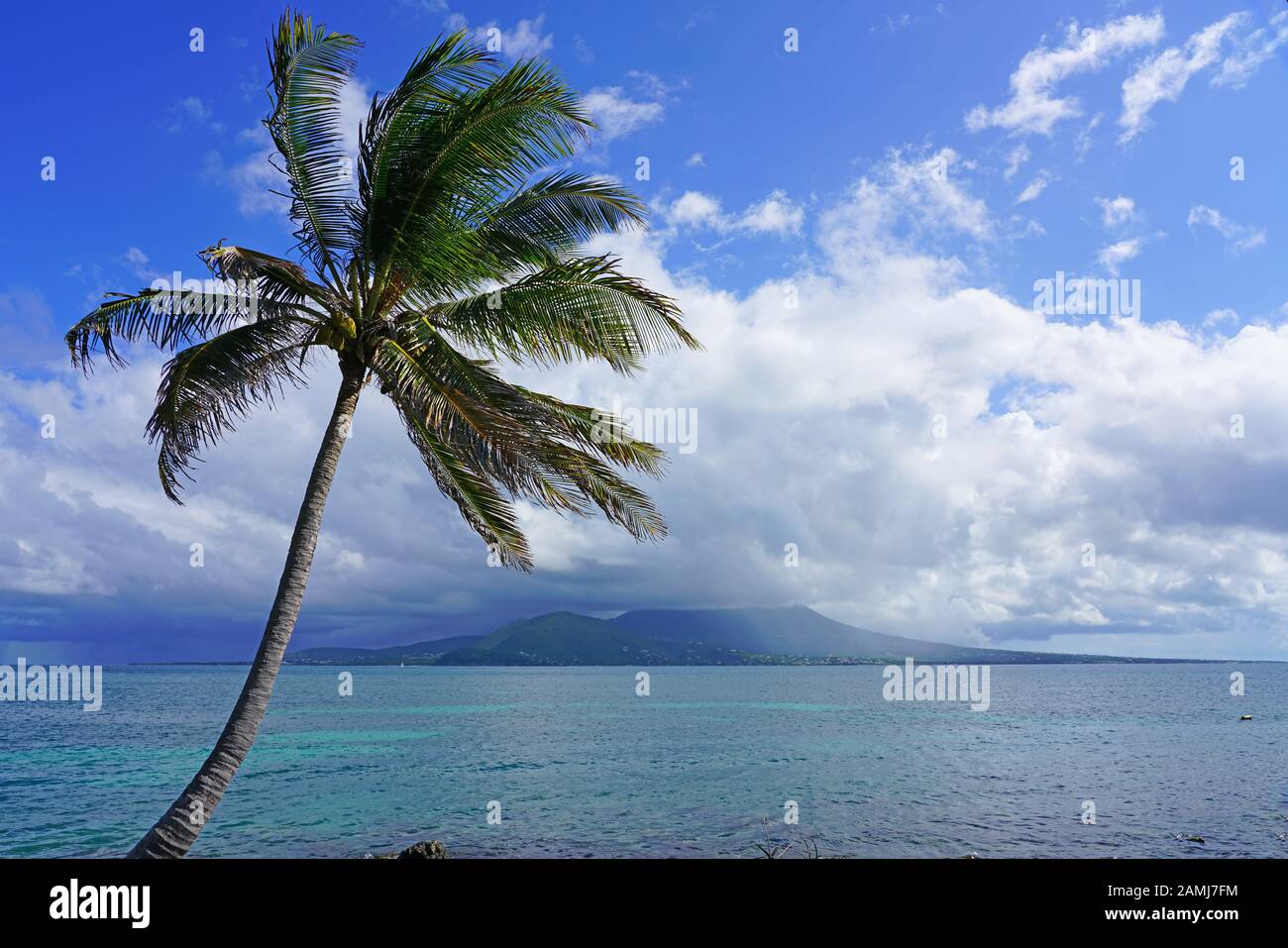 Day view of the Nevis Peak volcano across the water from St Kitts Stock ...