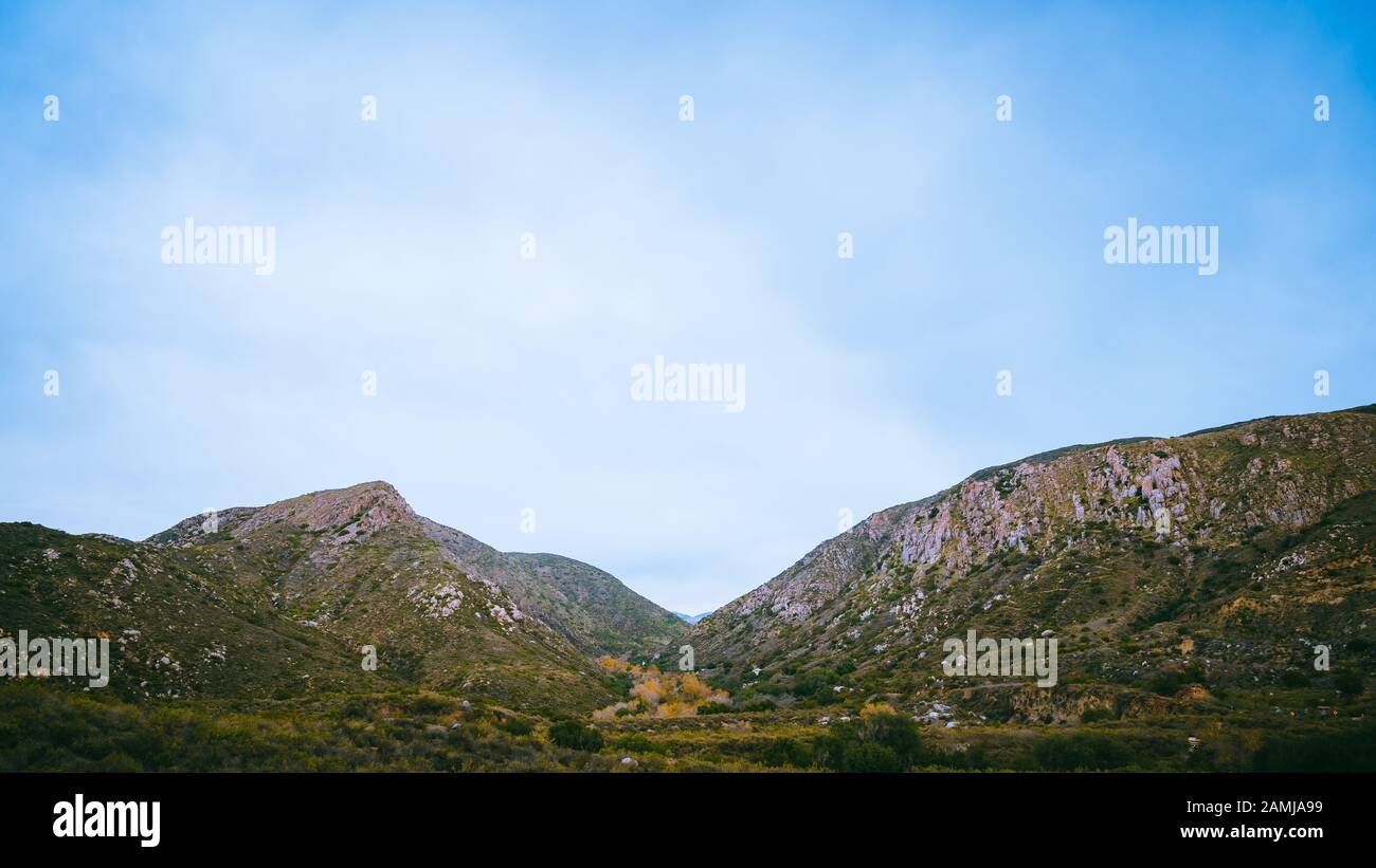 A small window between two hills Stock Photo - Alamy