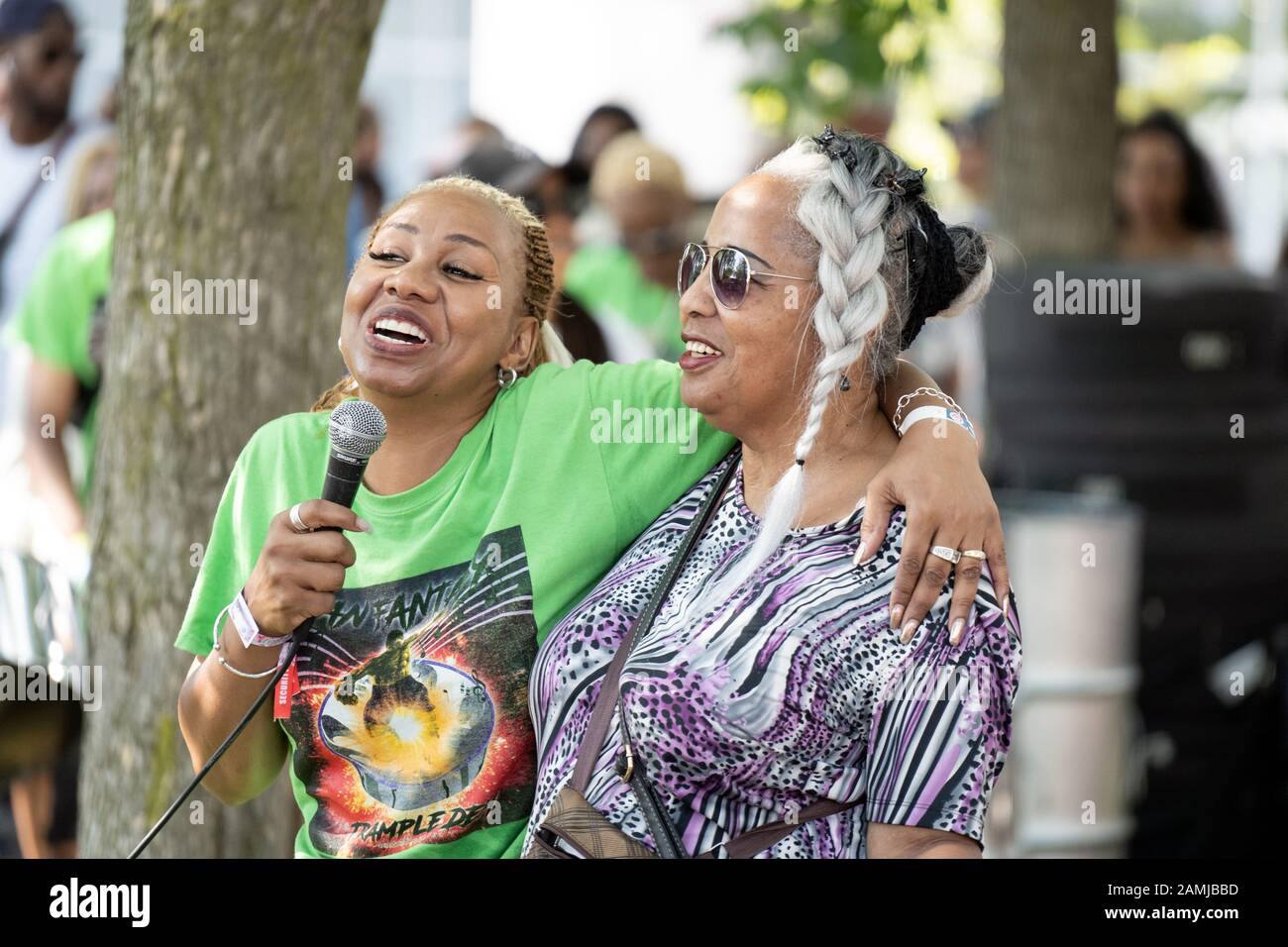 Happy singing crowd hi-res stock photography and images - Alamy