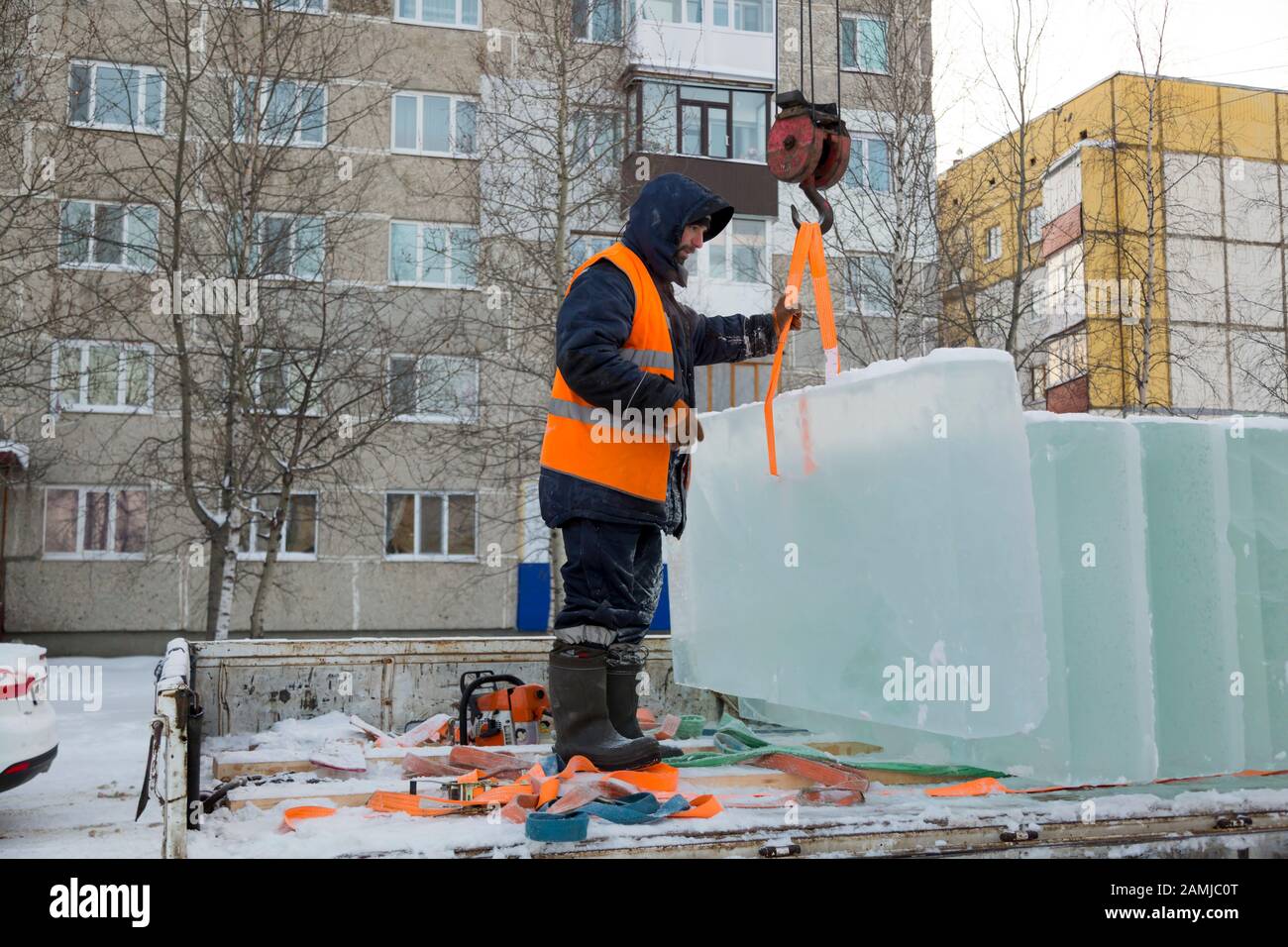 Portrait of installer at unloading ice blocks Stock Photo - Alamy