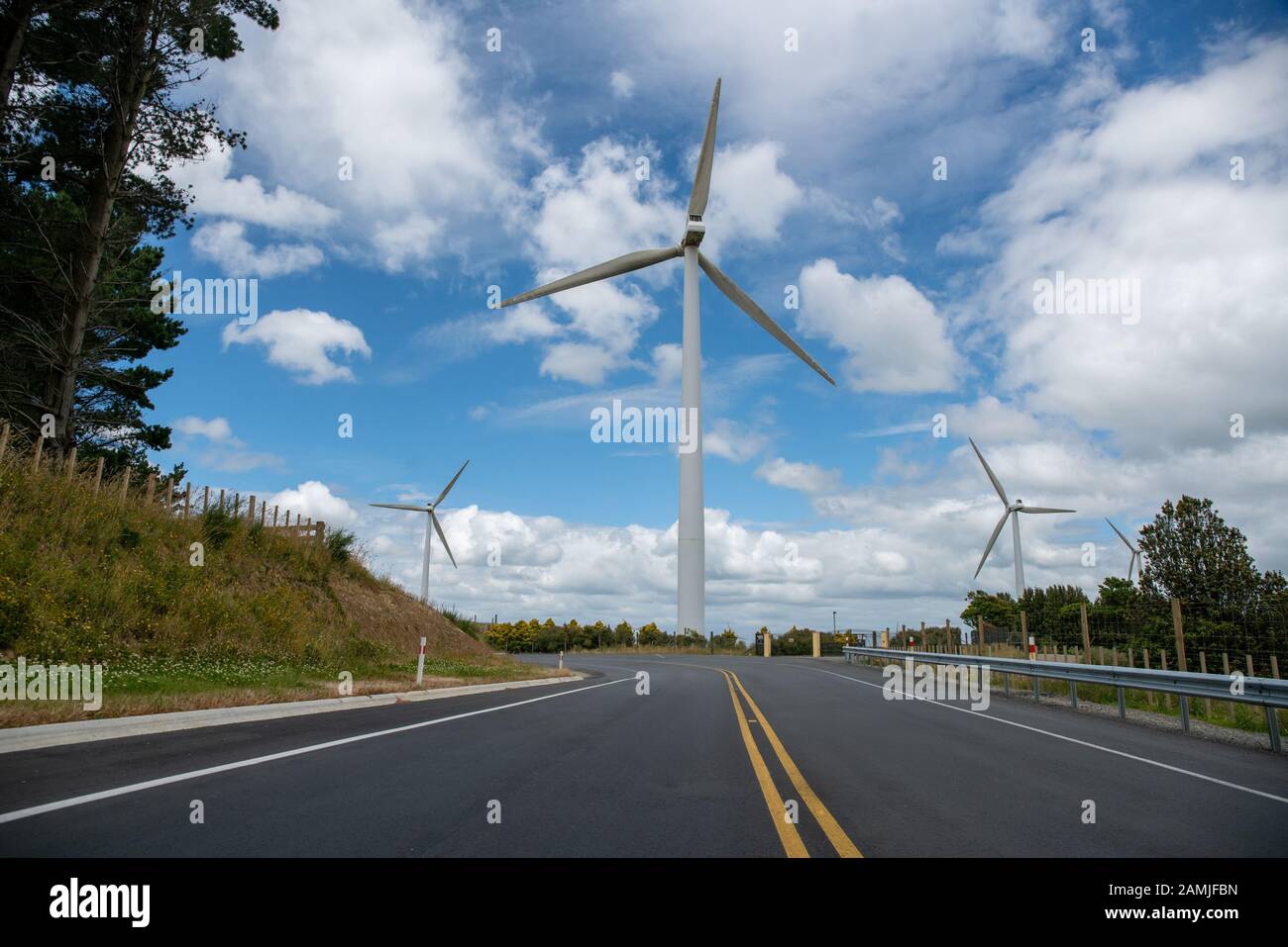 State highway heading beneath the giant Wind turbines generating ...