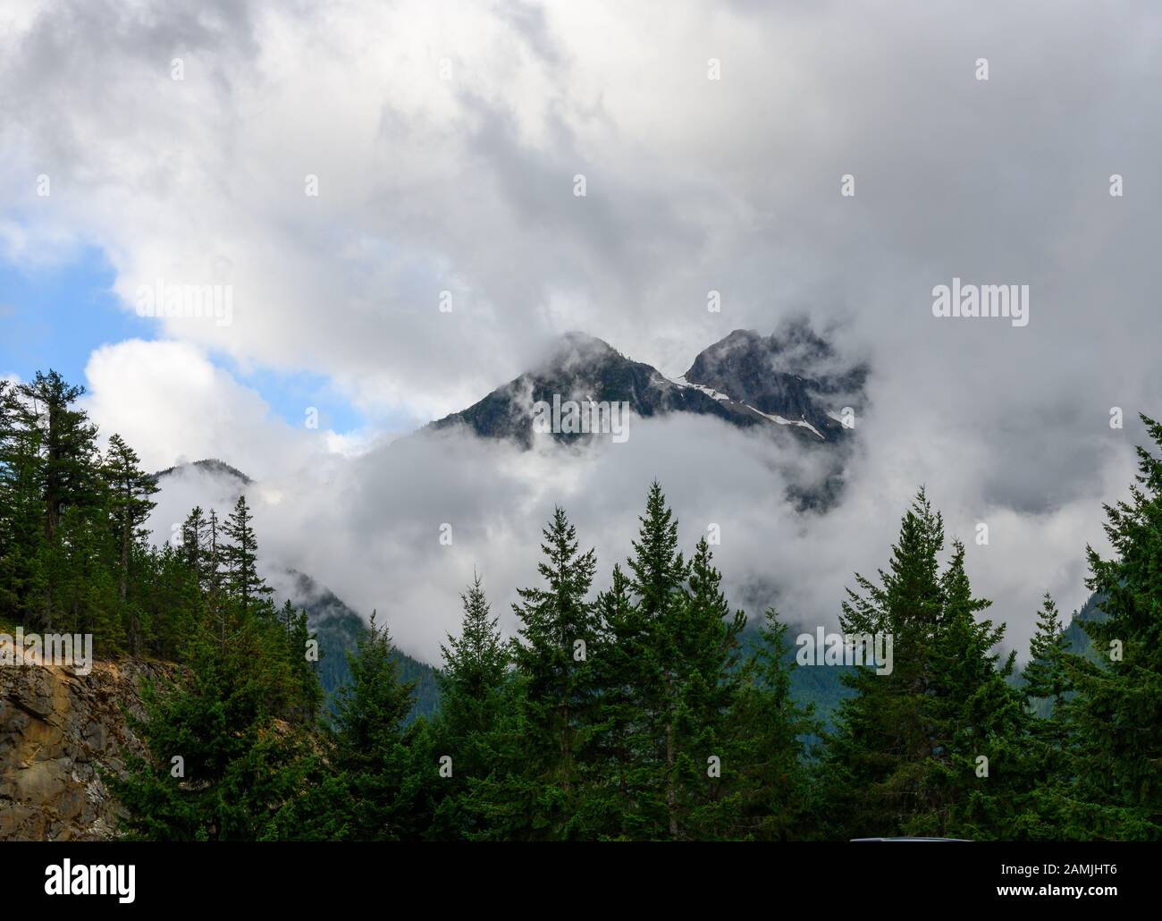 Thick Clouds Hover Around Mountains in Washington wilderness Stock ...