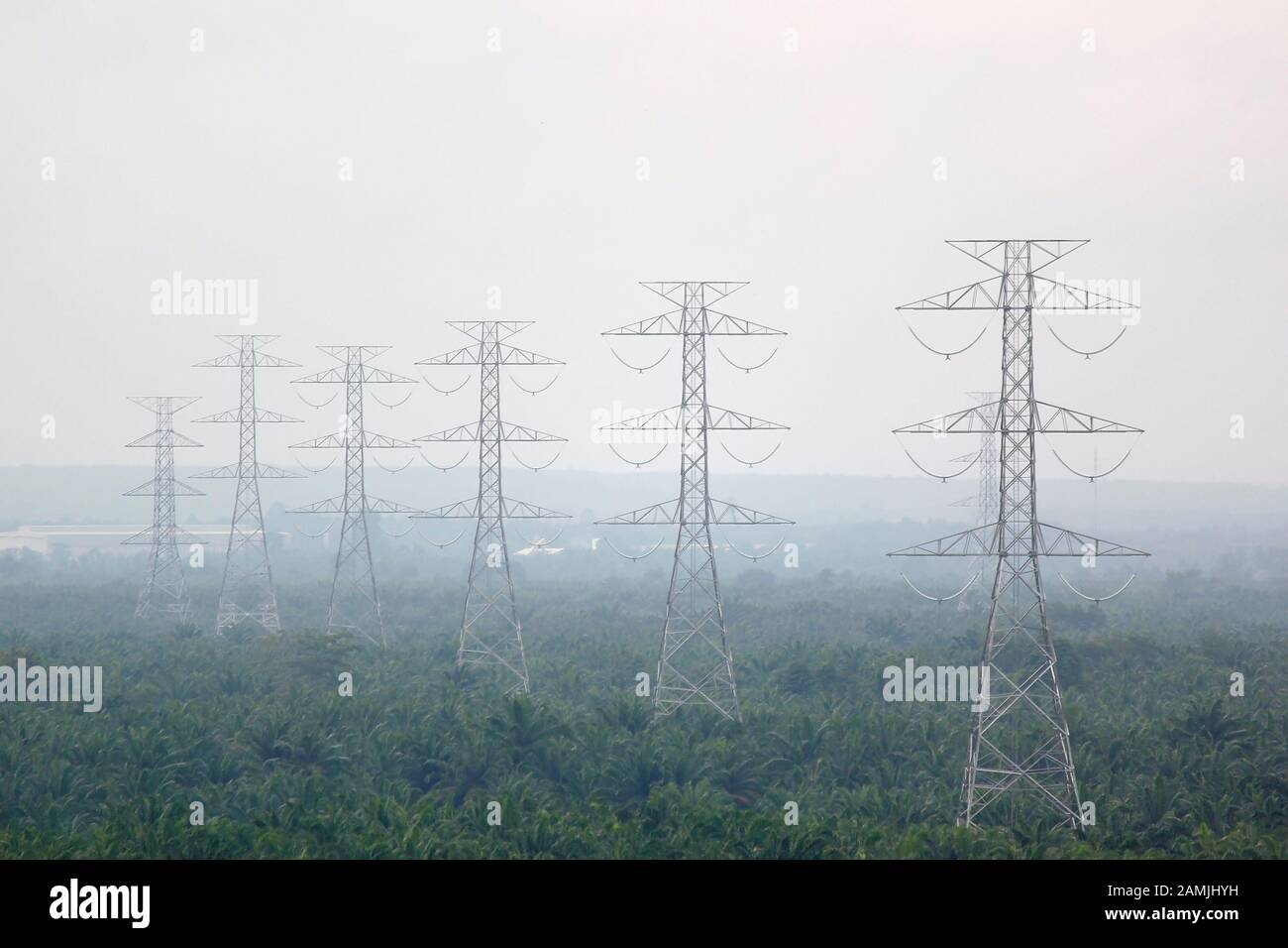 high voltage electric tower in foggy area Stock Photo - Alamy
