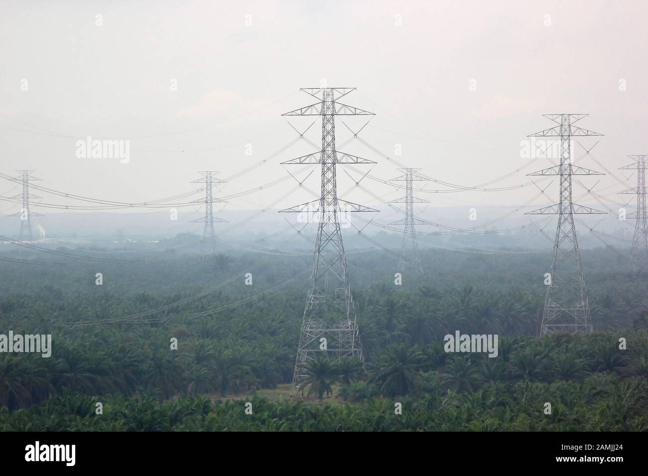 high voltage electric tower in foggy area Stock Photo - Alamy