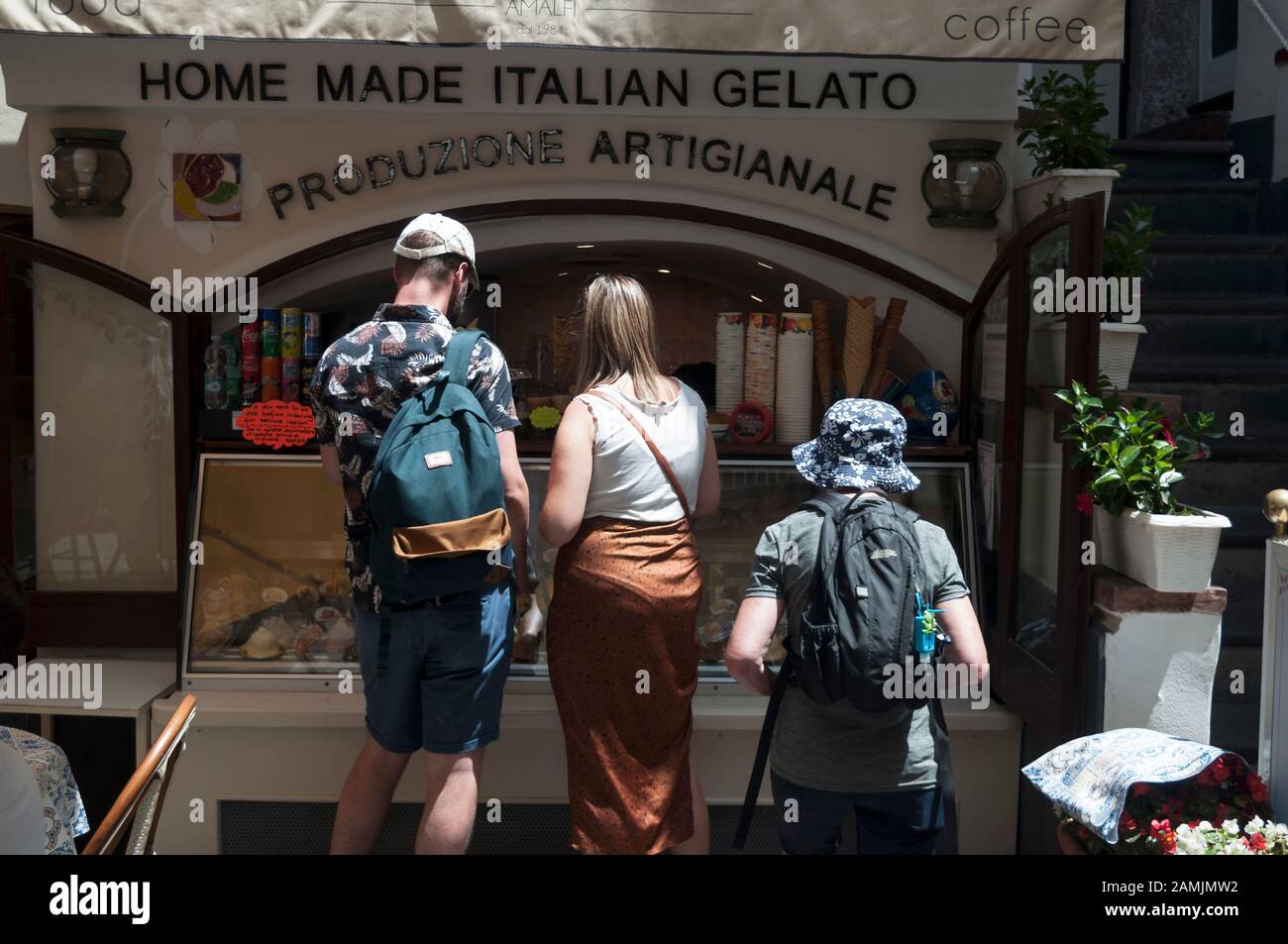 Visitors check out the offerings at a homemade Italian gelato place in ...