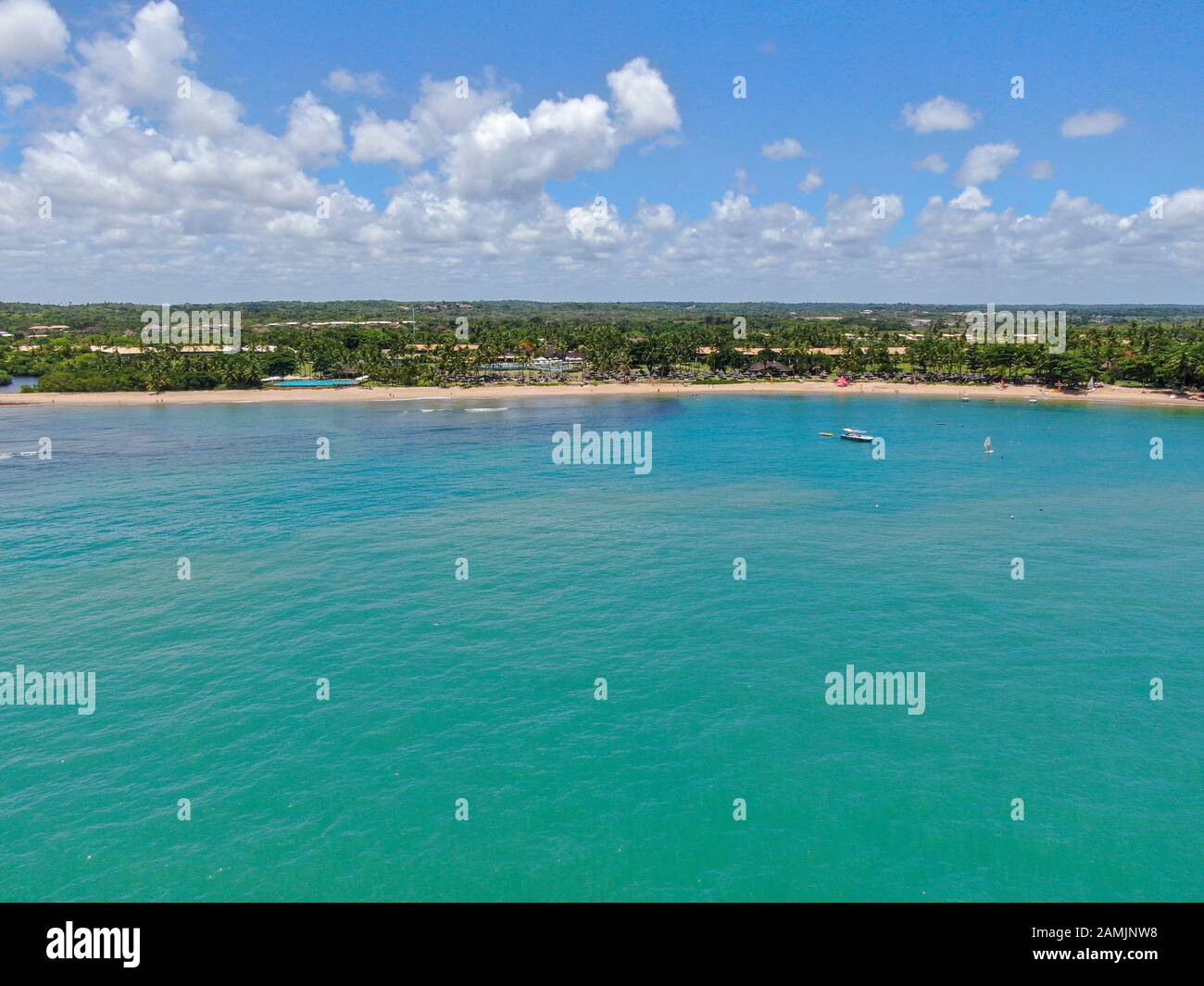 Aerial view of tropical white sand beach, palm trees and turquoise ...