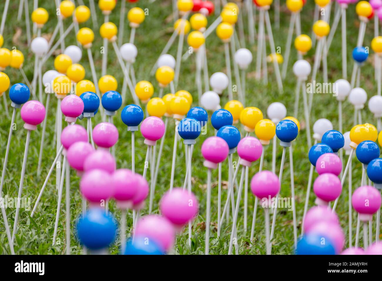 Many multi-colored plastic balls on legs Stock Photo - Alamy