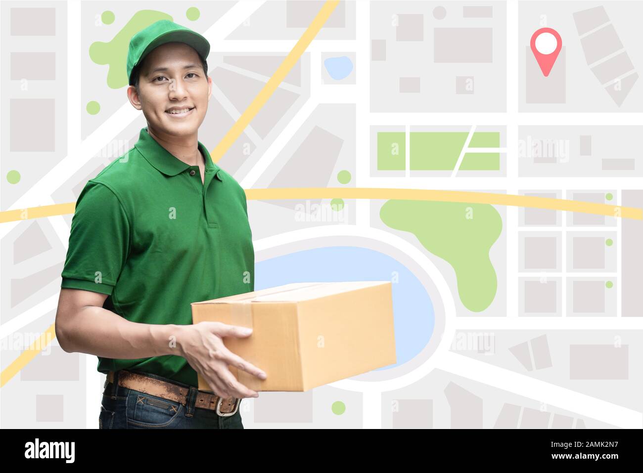 Asian delivery man holding a cardboard box ready for delivery to ...