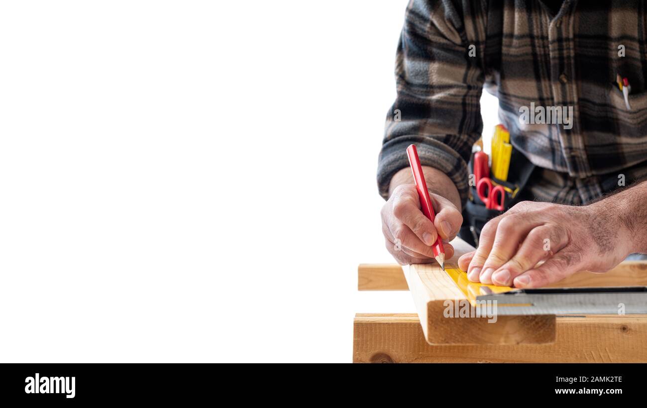Close-up. Carpenter with pencil and carpenter's square draw the cutting ...
