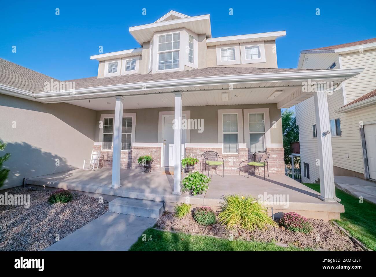Modern urban house with covered front veranda Stock Photo - Alamy