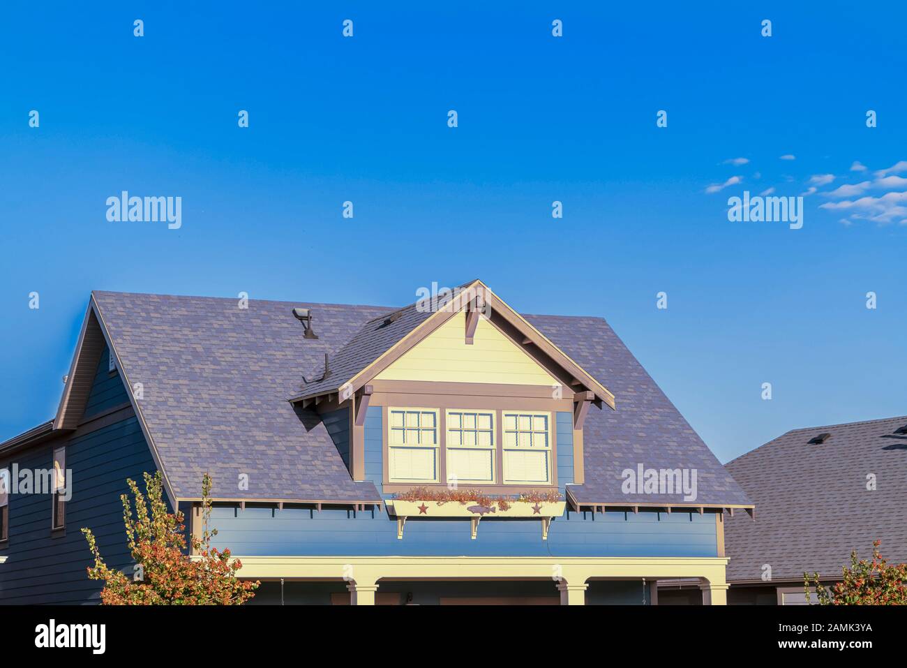 Large triple dormer window in an urban house Stock Photo - Alamy