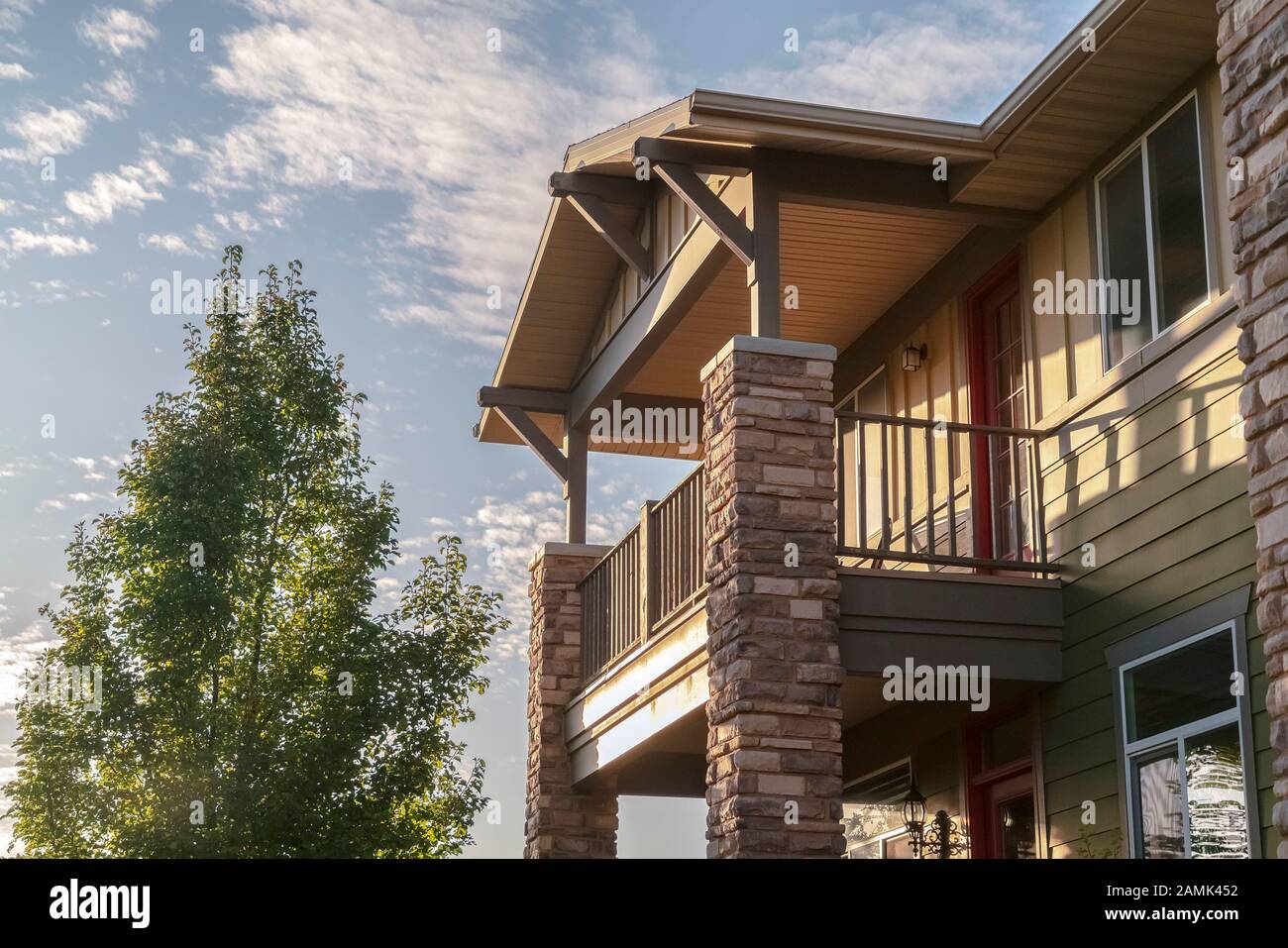Upper storey balcony on a brick and timber house Stock Photo - Alamy