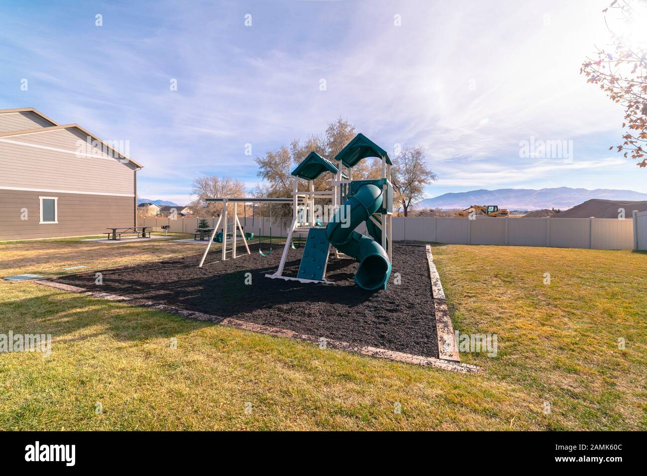 Kids playground in a walled park or estate Stock Photo - Alamy
