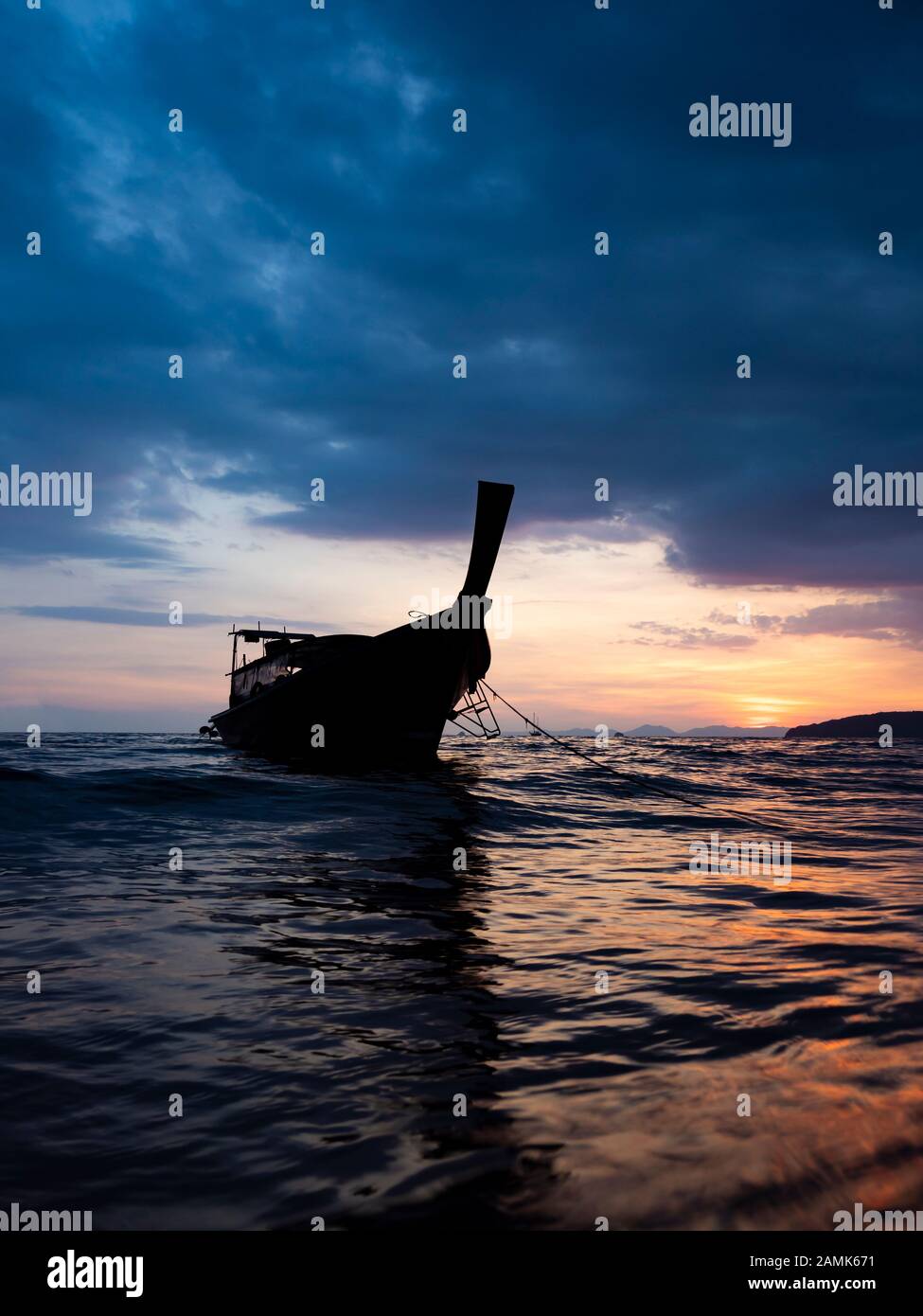 Traditional long-tail boat on the beach in Thailand Stock Photo - Alamy