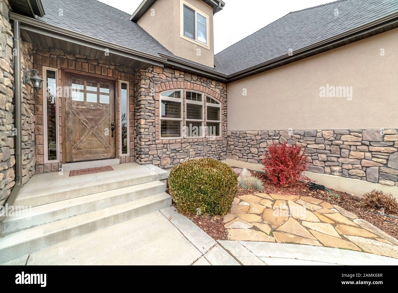 Modern urban home with feature stone brick wall Stock Photo - Alamy