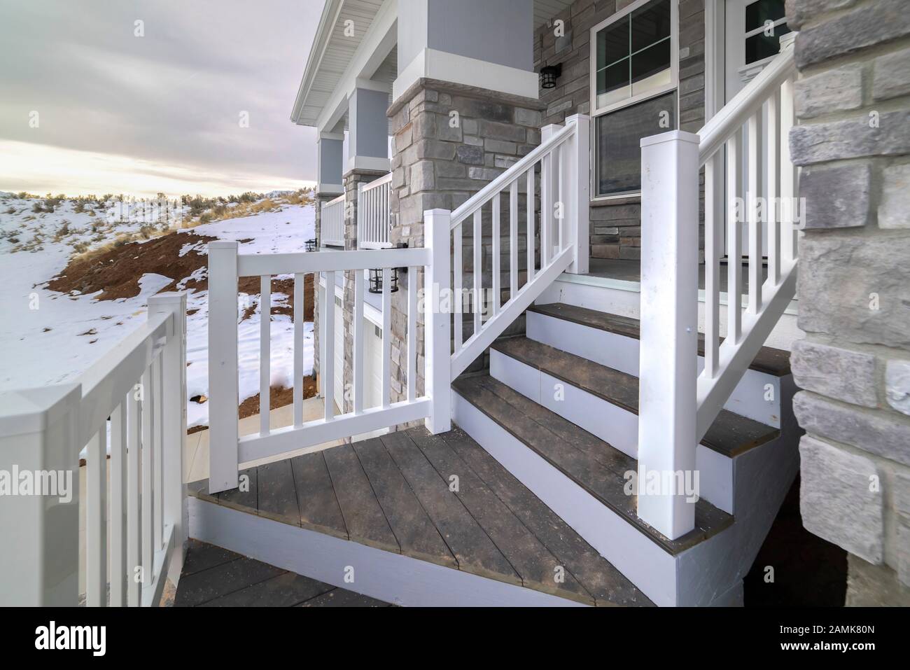 Winding wooden stairs to a house front door Stock Photo - Alamy