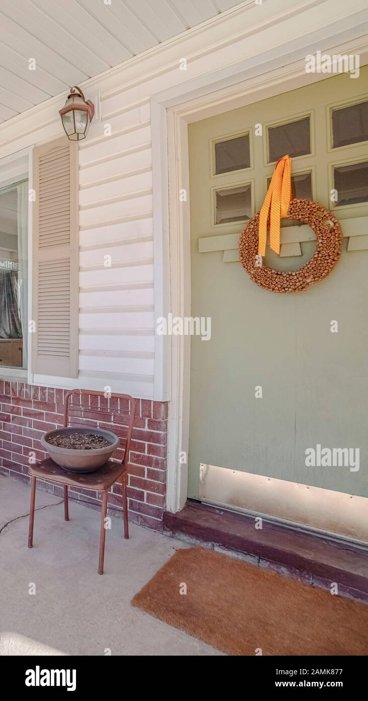 Vertical frame Two rocking chairs on a covered front porch Stock Photo ...