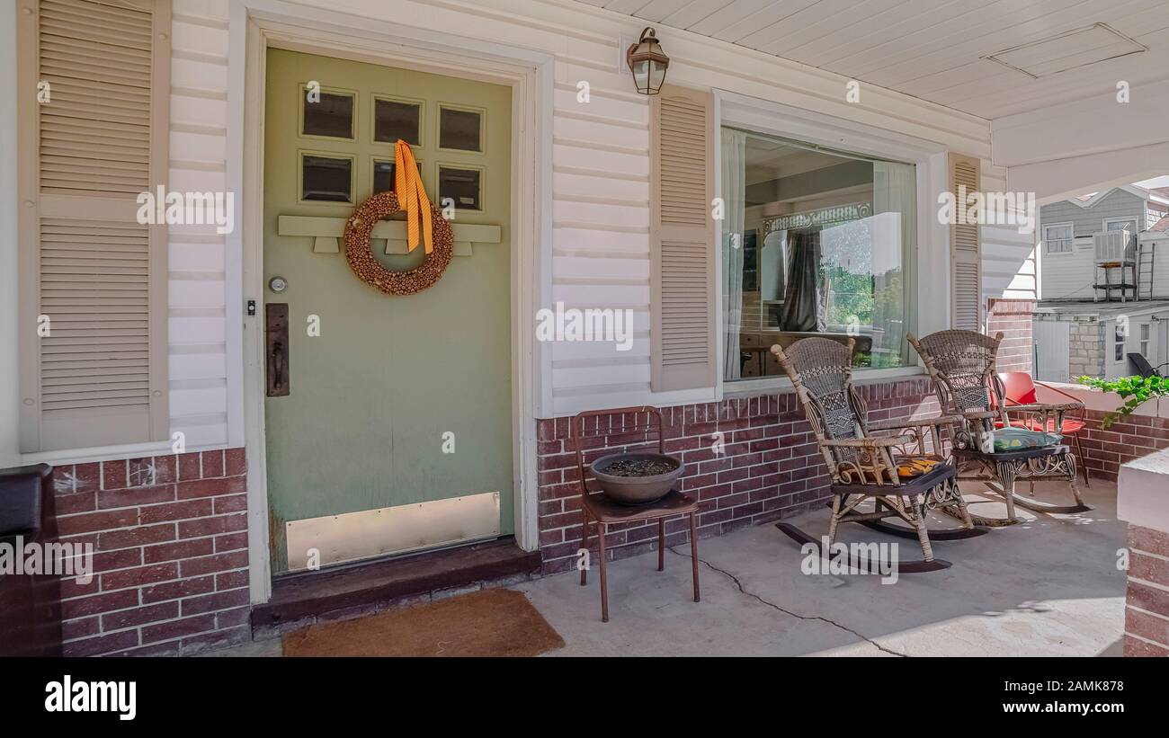 Panorama Covered front porch with rocking chairs day light Stock Photo ...