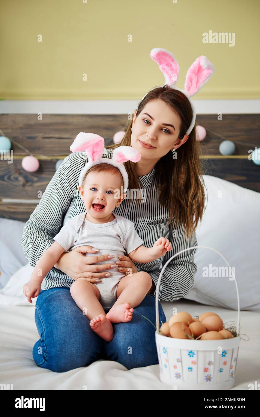 Portrait of mum and baby celebrating Easter in bed Stock Photo - Alamy