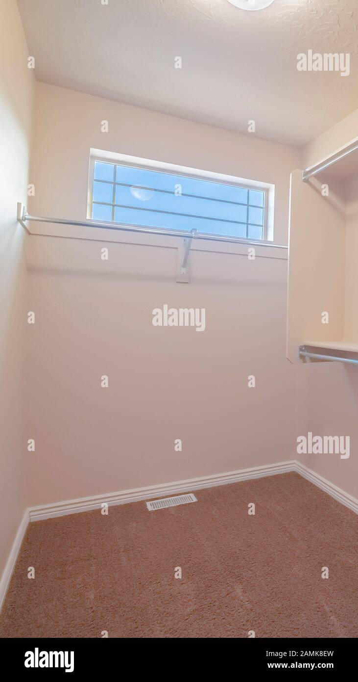 Vertical frame Small empty white room with shelves bright interior ...