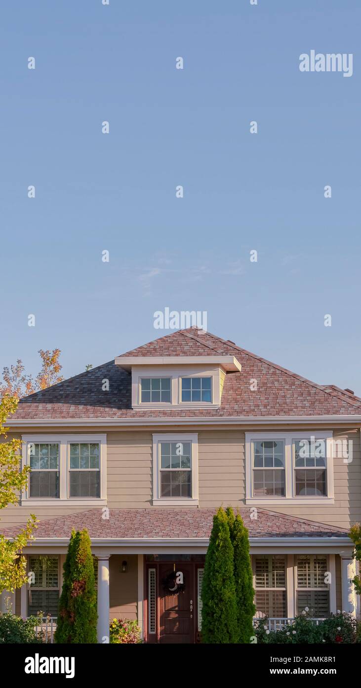 Vertical Street view of a modern timber clad house Stock Photo - Alamy