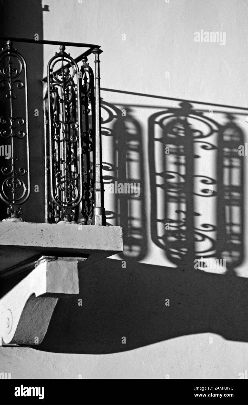urban view with a section of a balcony and its shadow projected on the ...