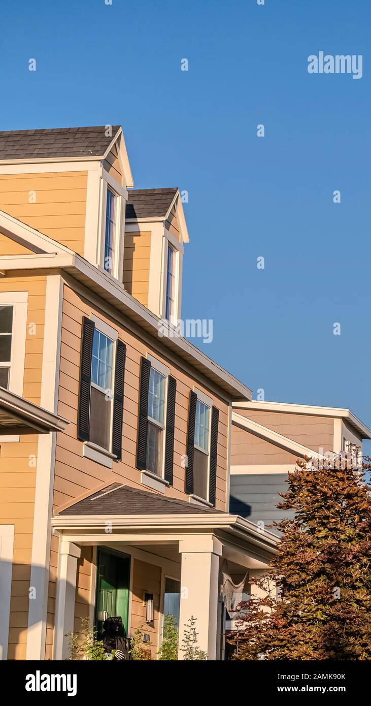 Exterior of modern house surrounded by trees and green grass hi-res ...