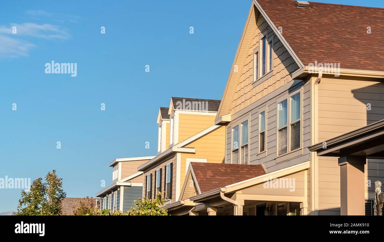 Panorama frame Row of double storey timber clad homes Stock Photo - Alamy