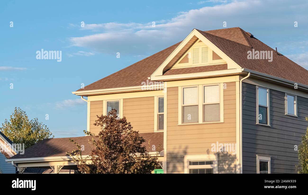 Panorama Double storey brown timber house with white trim Stock Photo ...