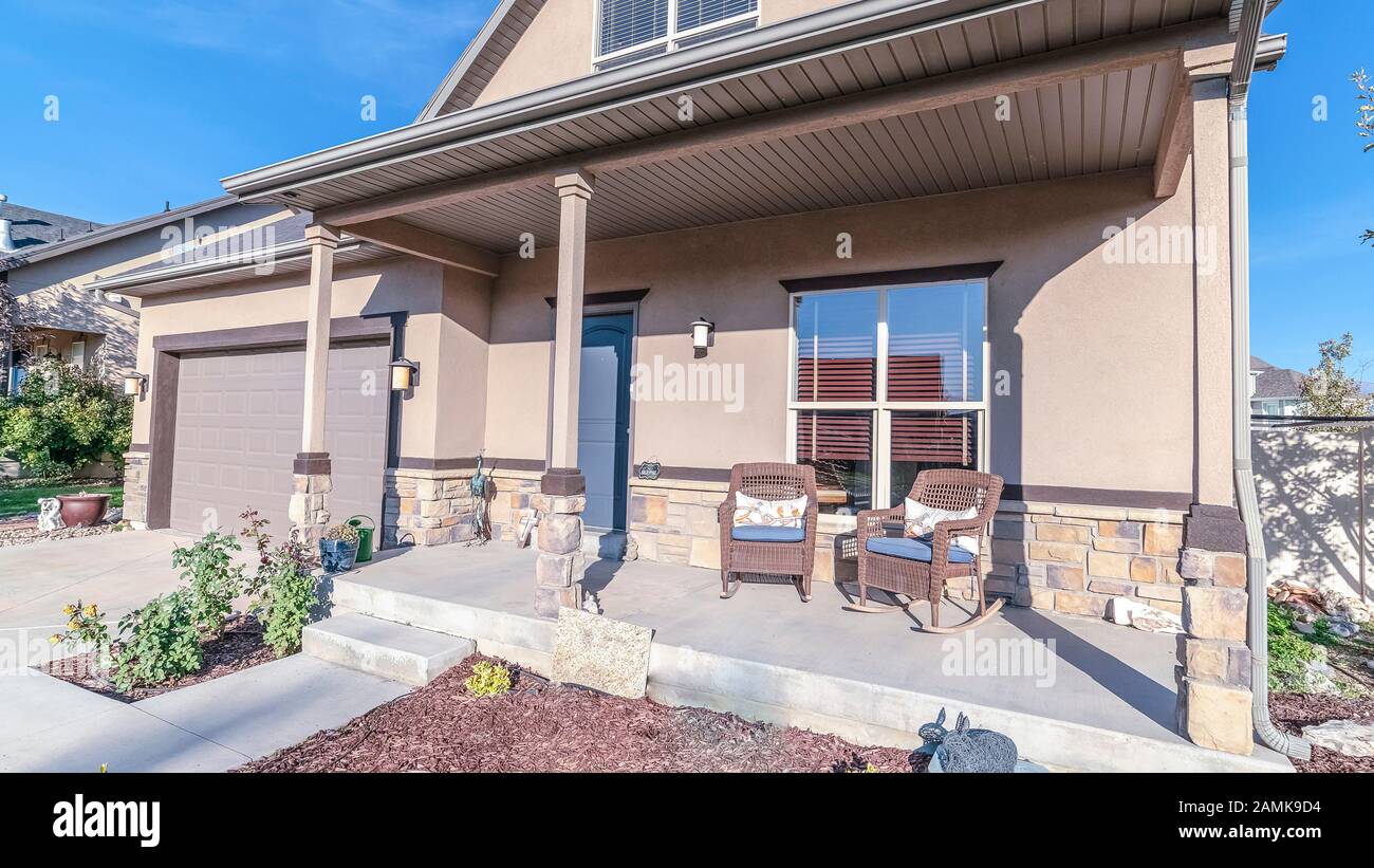 Panorama Two chairs on a covered front porch Stock Photo - Alamy