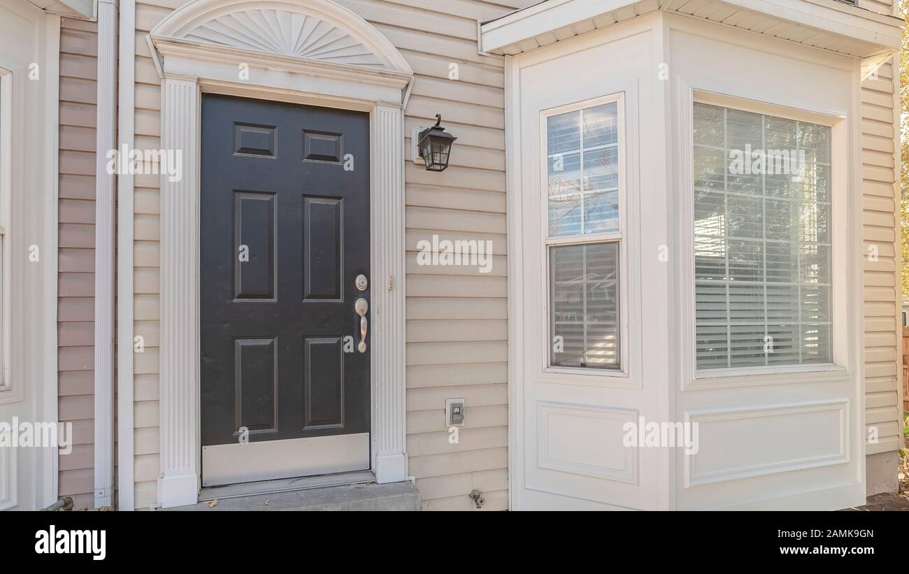 Panorama Small external bay window on a wooden house Stock Photo - Alamy