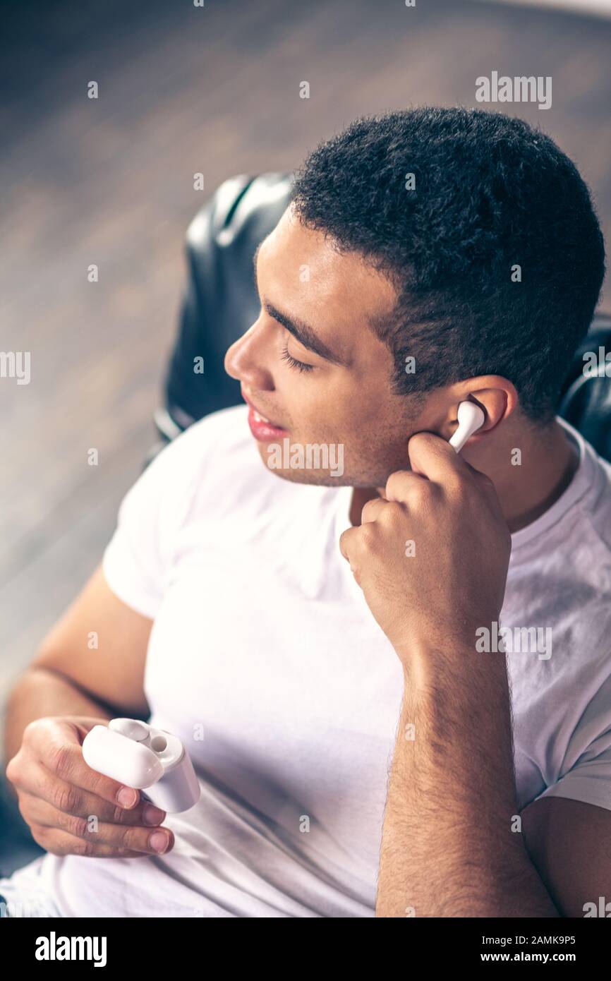 Joyful black guy listening hi-res stock photography and images - Alamy