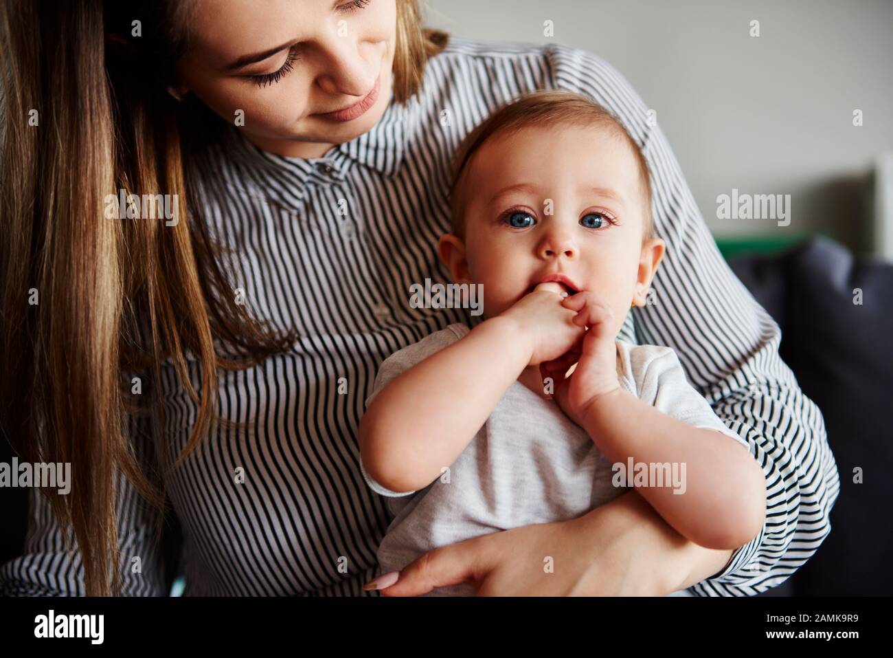 Young mother hold baby hi-res stock photography and images - Alamy