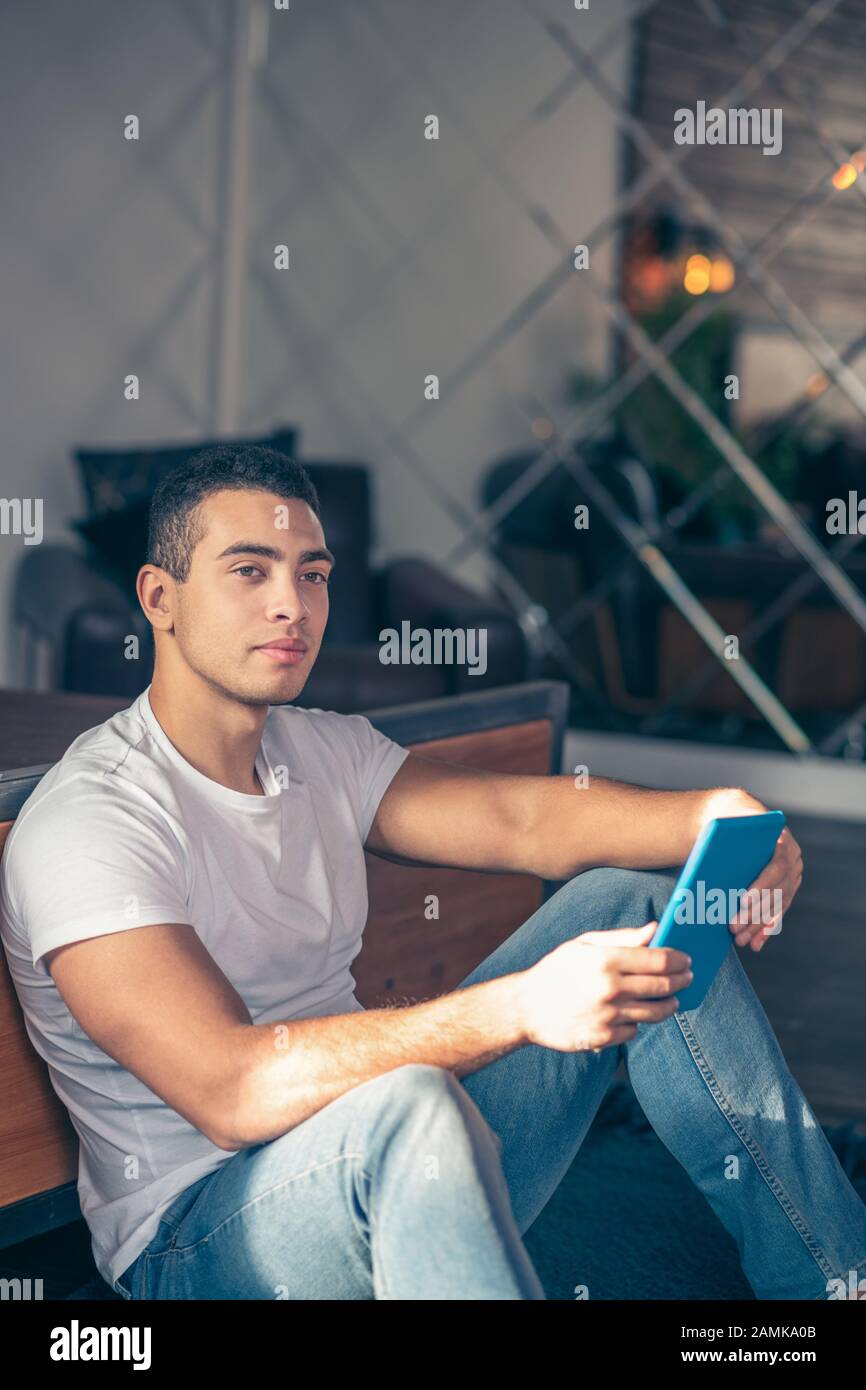 Man sitting floor muscles hi-res stock photography and images - Alamy