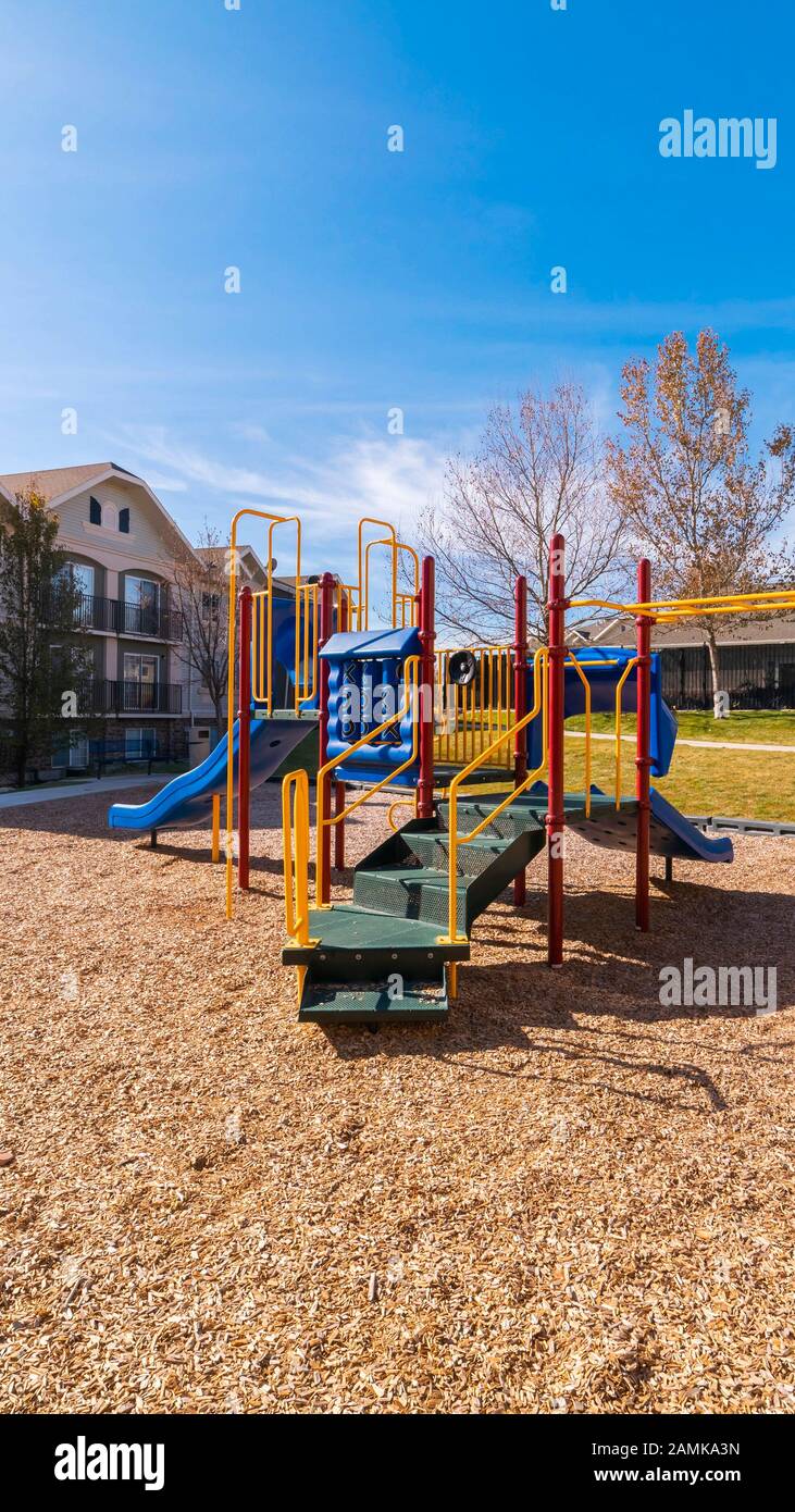 Vertical frame Small kids playground in an urban park Stock Photo - Alamy