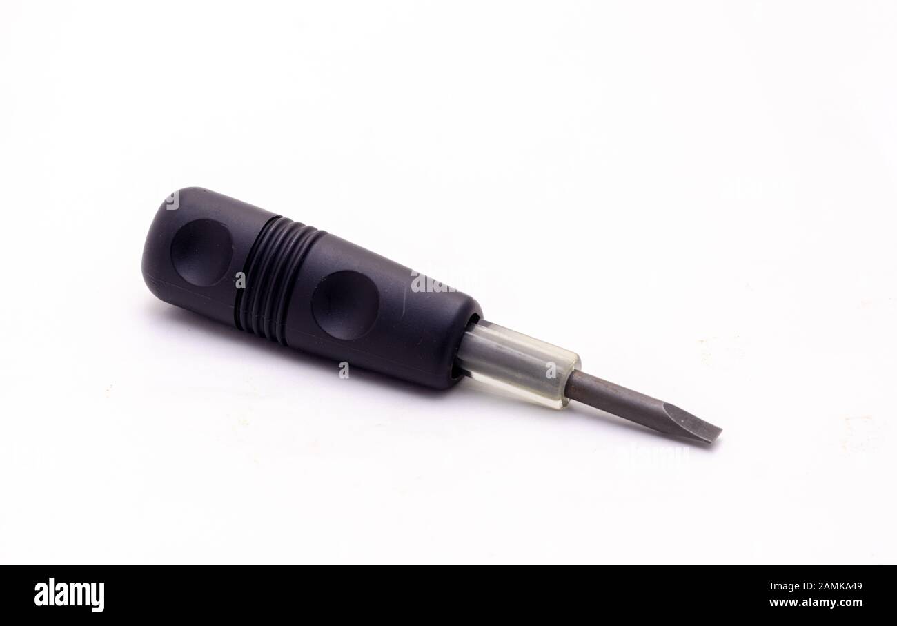 Screwdriver with black plastic handle isolated on white background ...