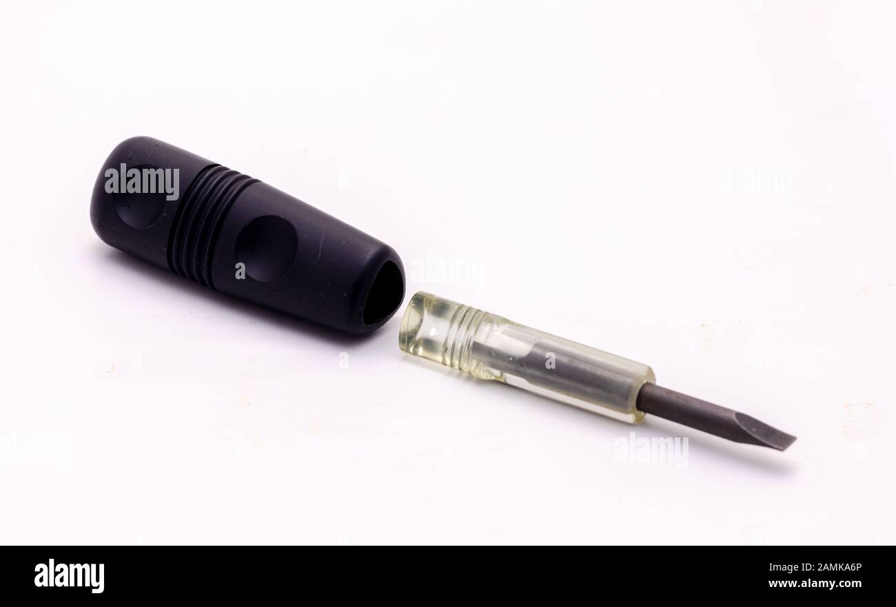Screwdriver with black plastic handle isolated on white background ...