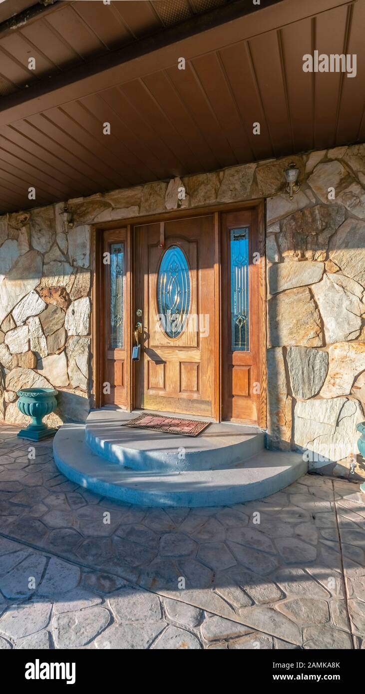 Vertical frame Modern house with paved patio and circular steps Stock ...