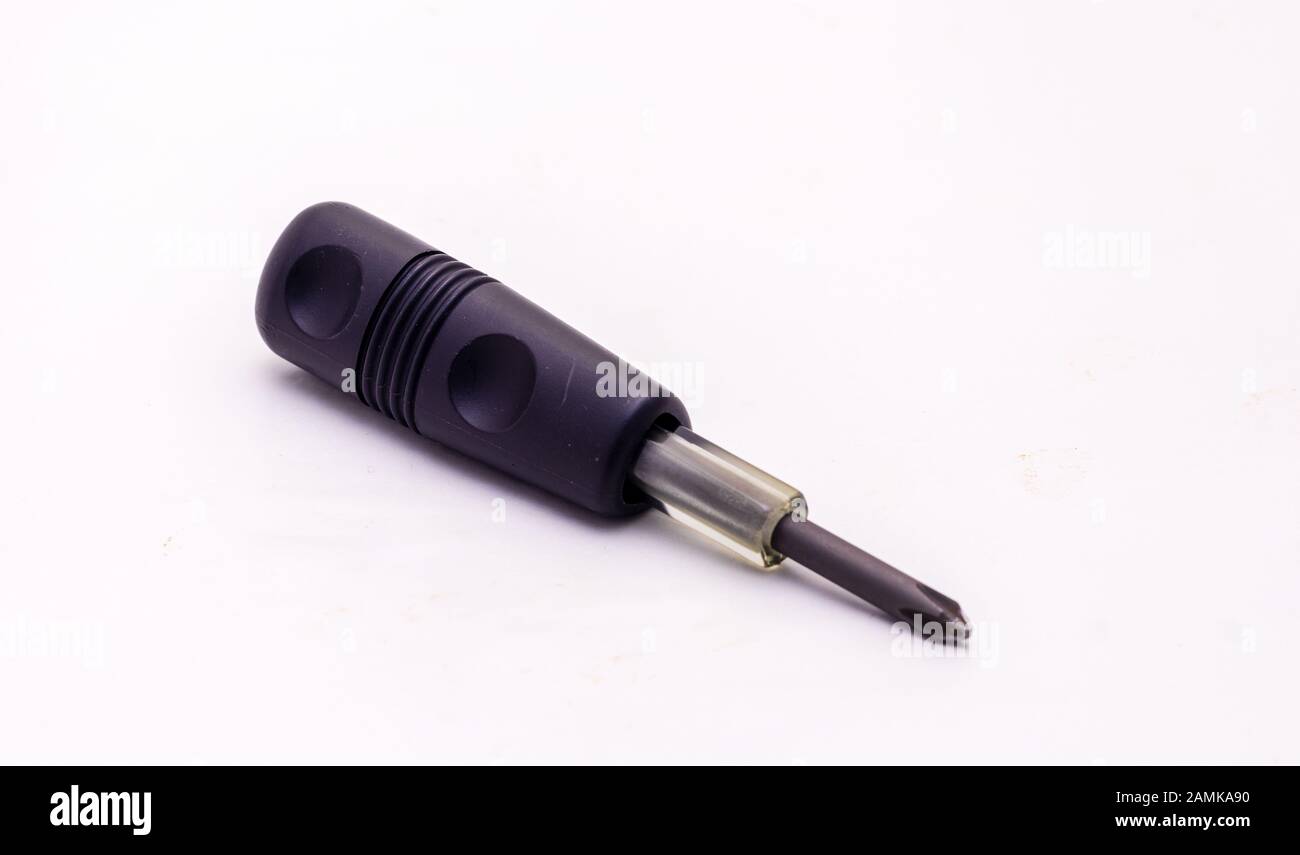 Phillips screwdriver with black plastic handle isolated on white ...
