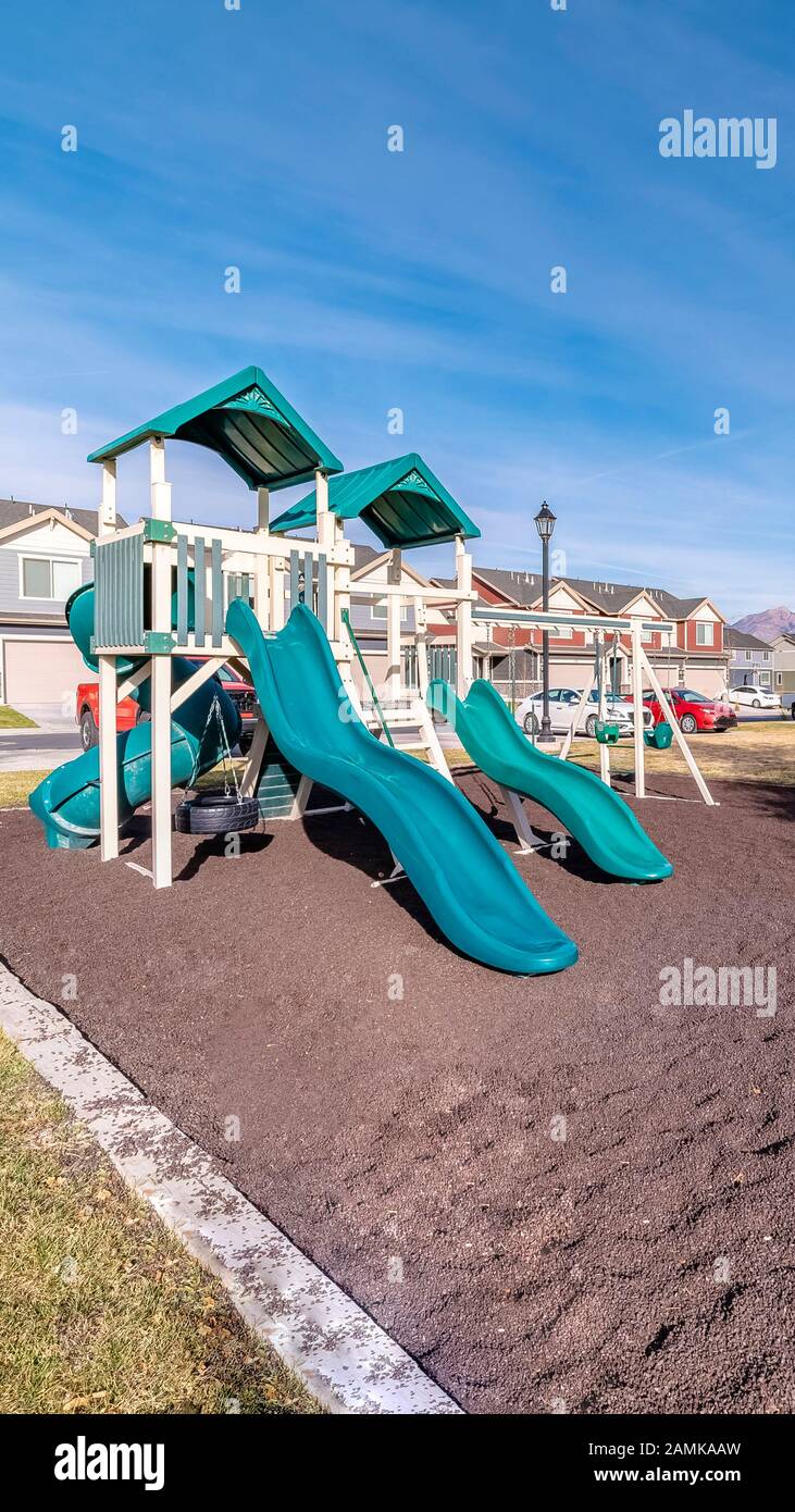 Vertical frame Colourful bright blue slides in a kids playground Stock ...