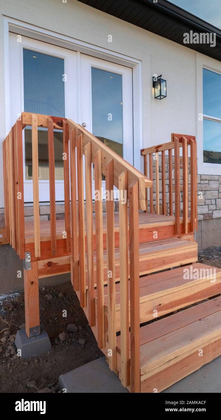 Vertical frame Wooden steps leading to an elevated front door Stock ...