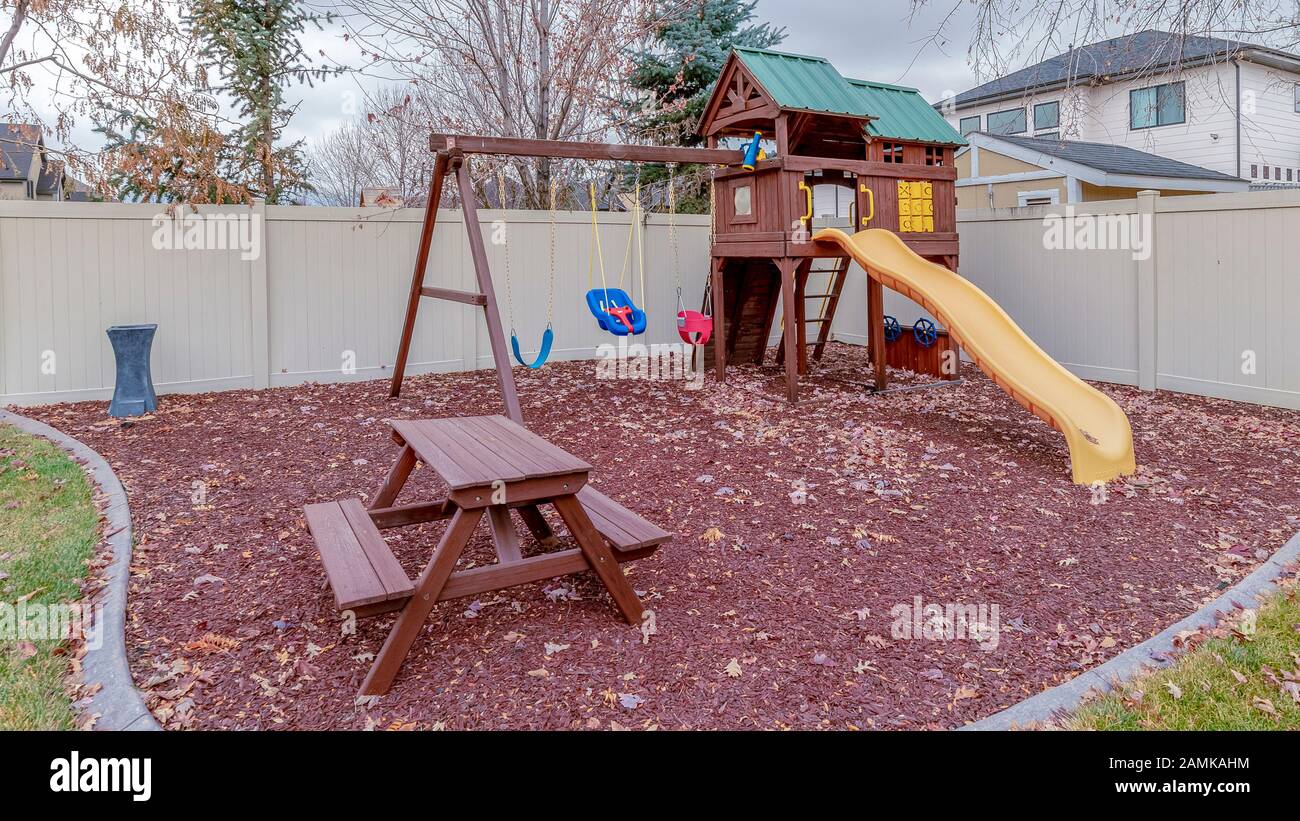 Panorama frame Small kids playground in a private backyard Stock Photo ...