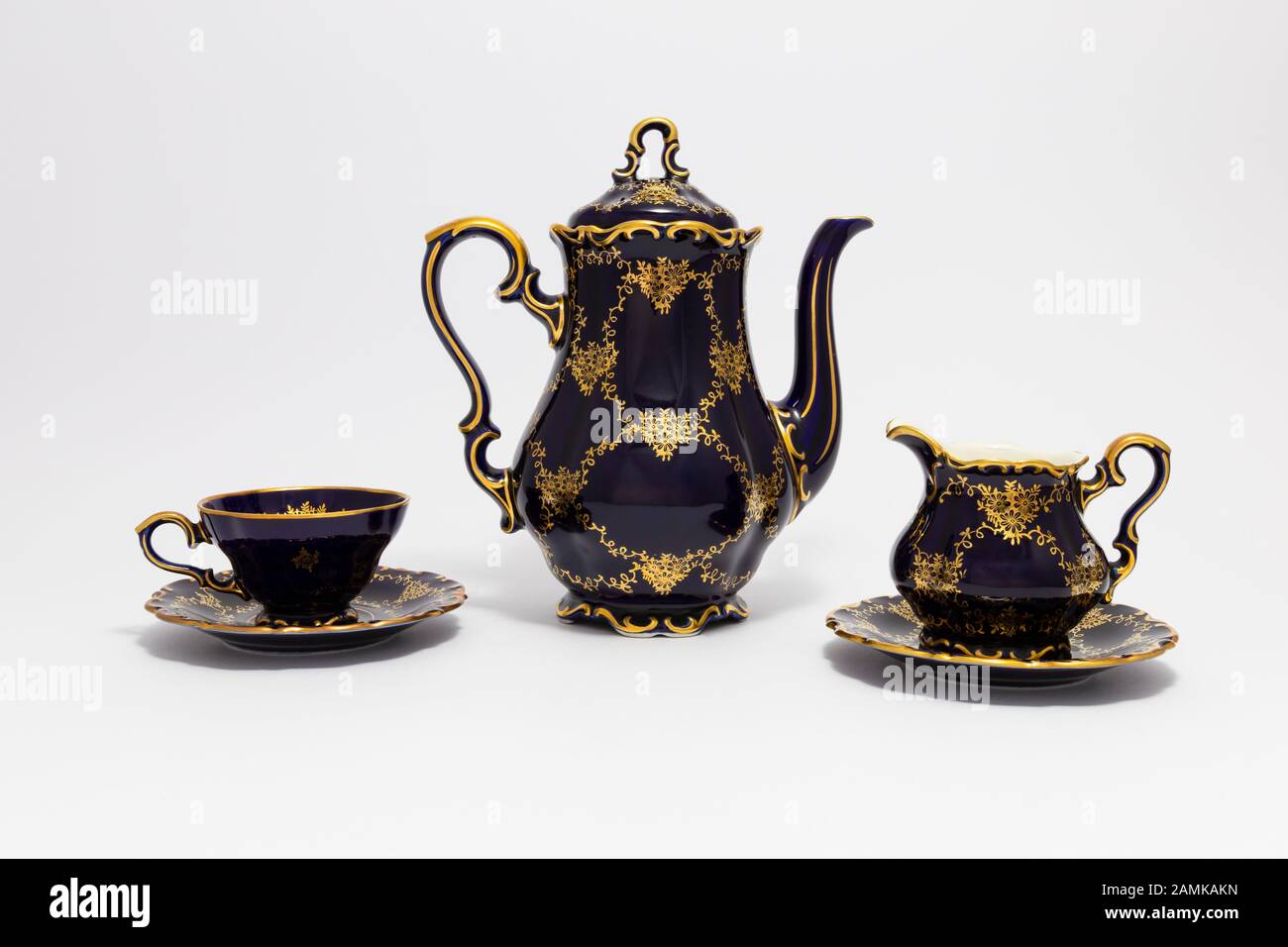 Closeup of a beautiful cobalt blue colored vintage porcelain tea set ...